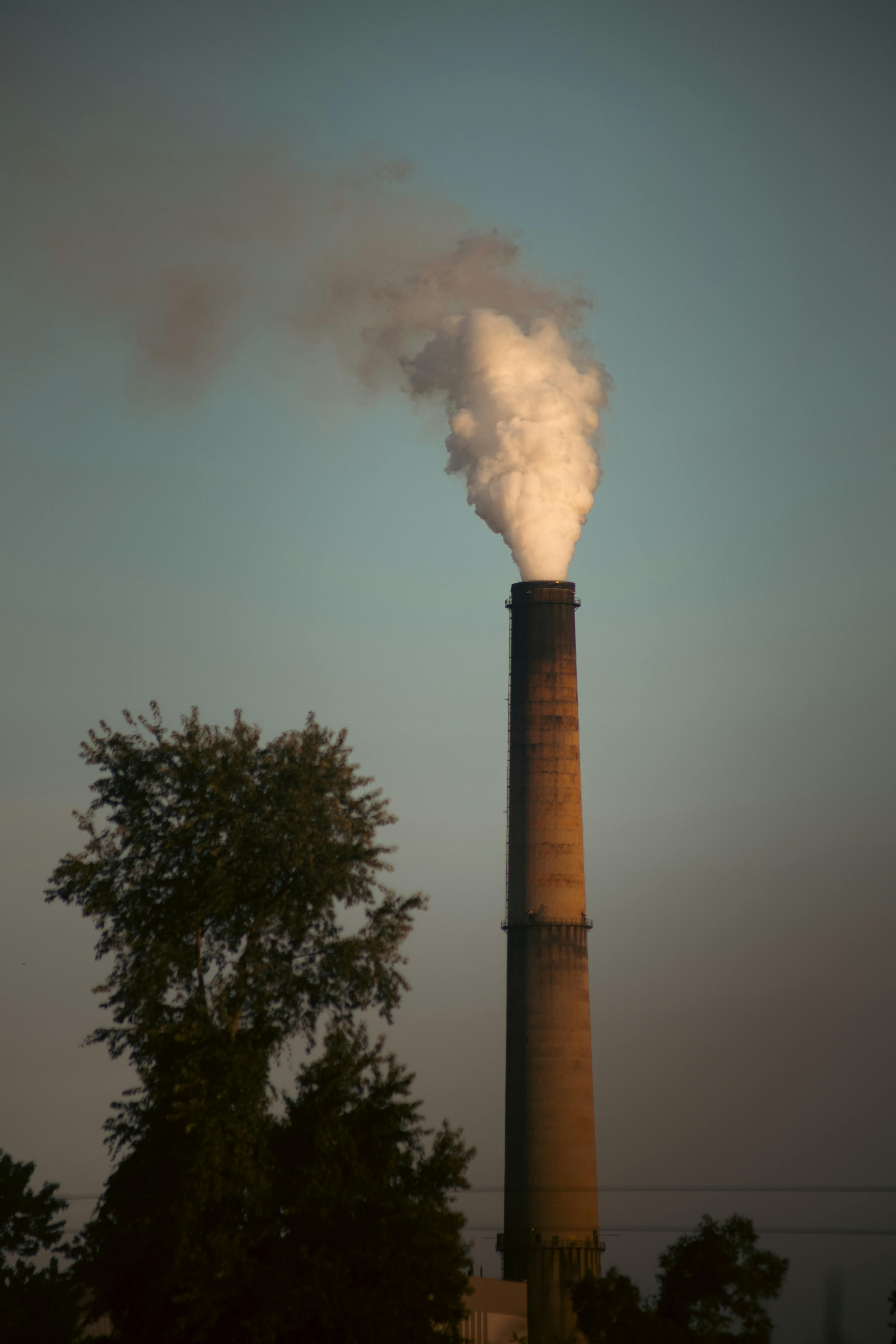 Red and White Smokestacks of a Power Plant Under White Clouds · Free ...