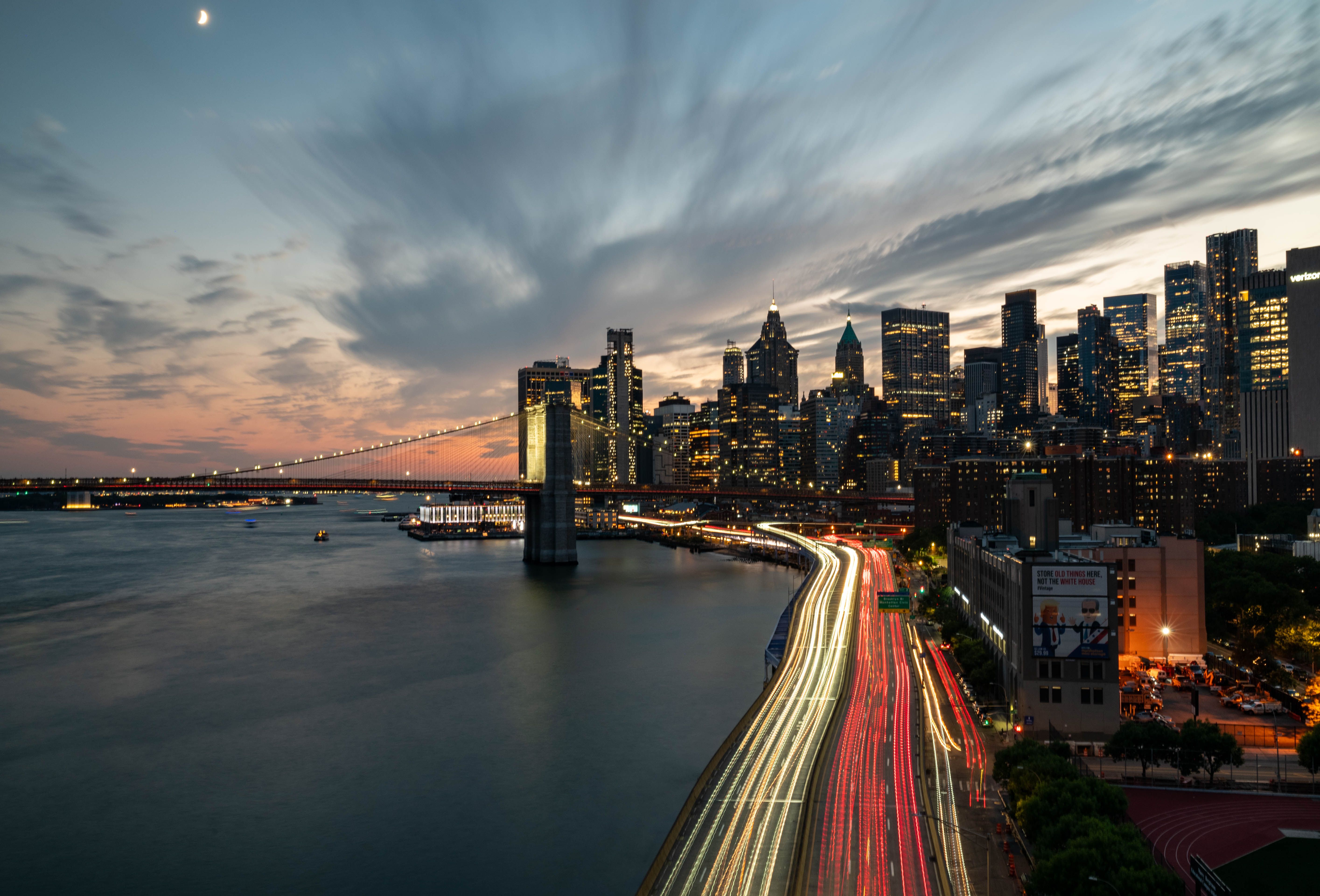 A long exposure photograph of the city skyline at sunset · Free Stock Photo