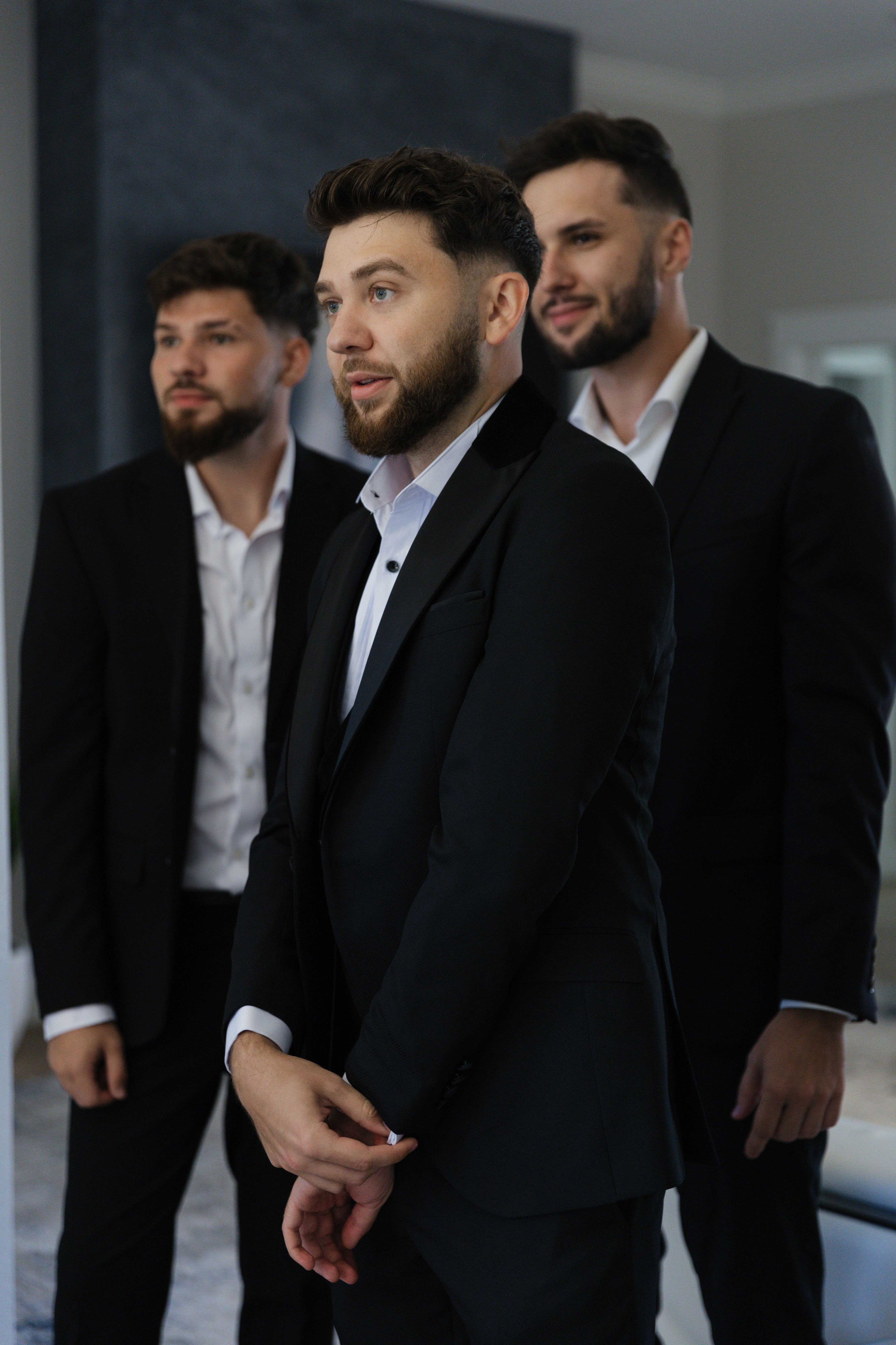 Three men in suits standing next to each other · Free Stock Photo