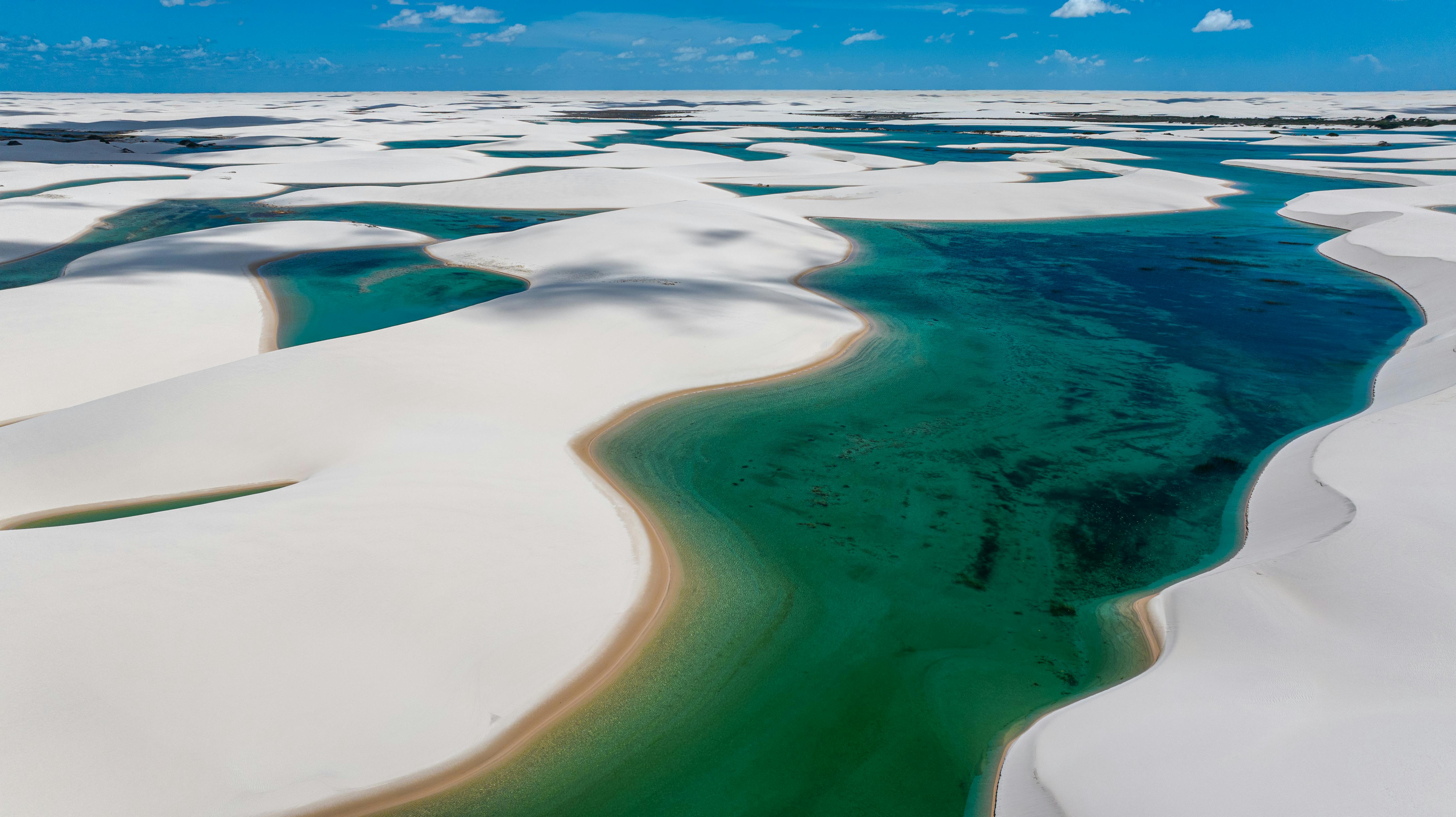 Aerial view of the white sand dunes and water · Free Stock Photo