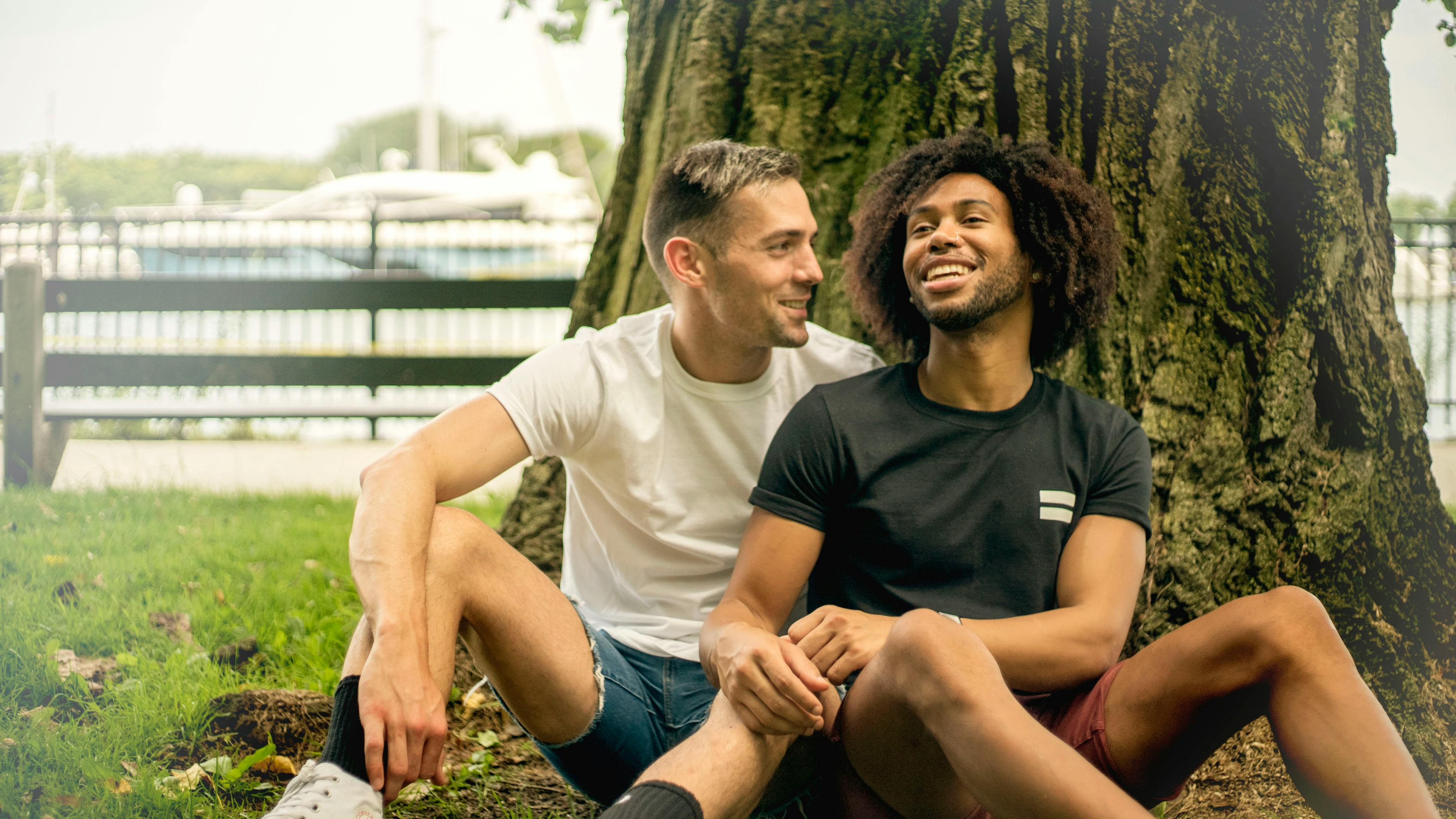 Two Men Standing on Grass Field · Free Stock Photo