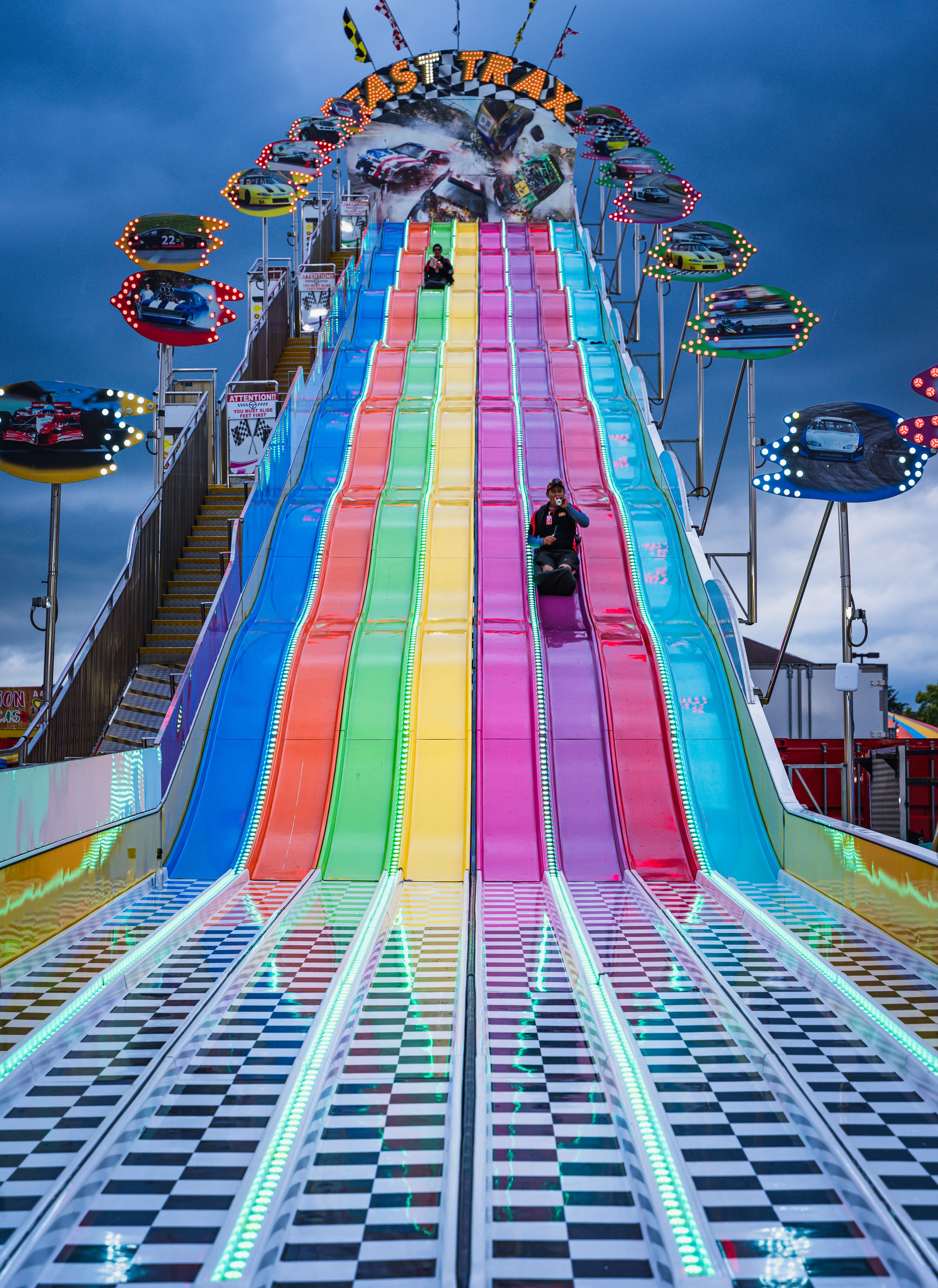A colorful slide at an amusement park · Free Stock Photo