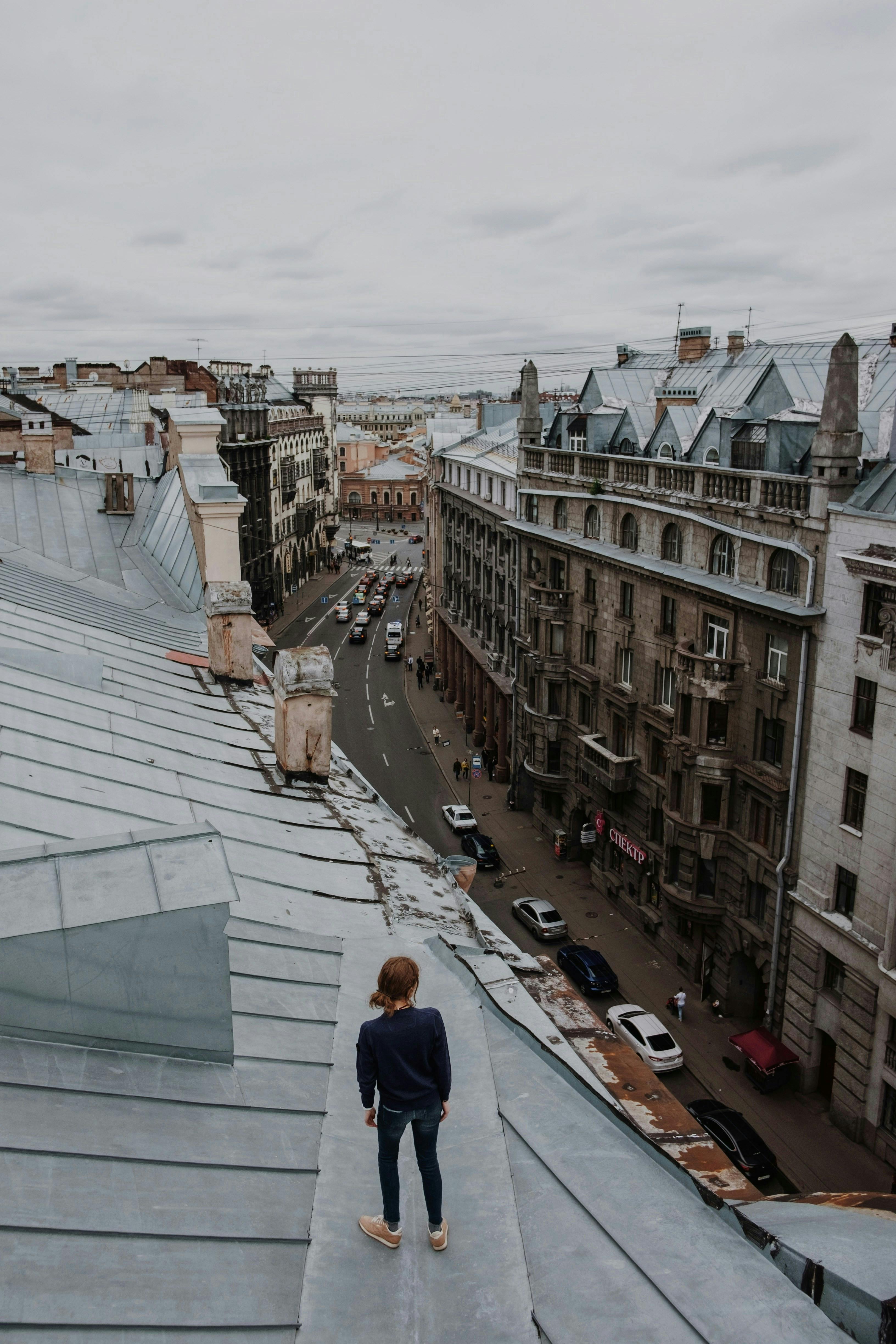 Woman Standing on Rooftop in Paris · Free Stock Photo