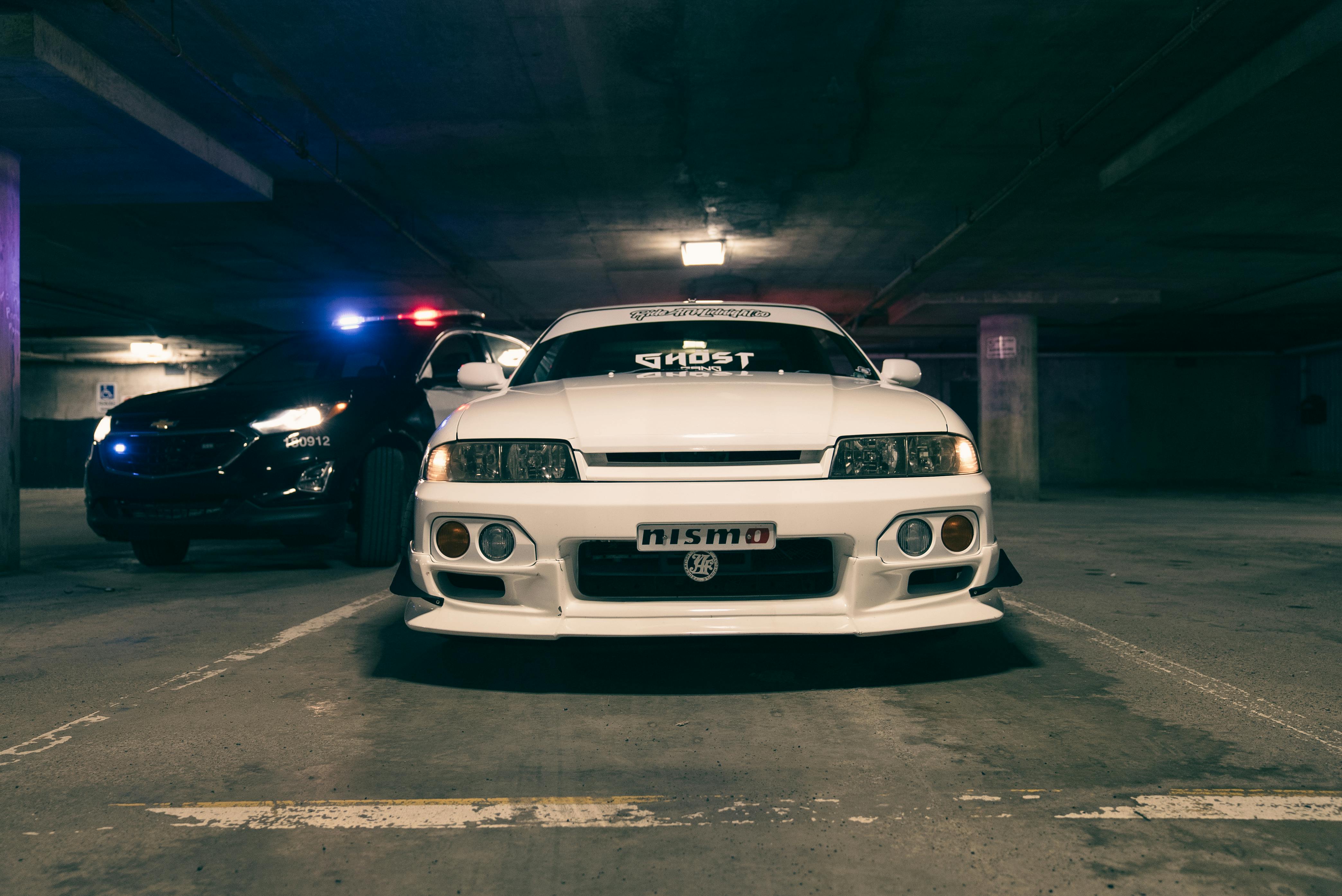 A police car parked in a parking garage · Free Stock Photo