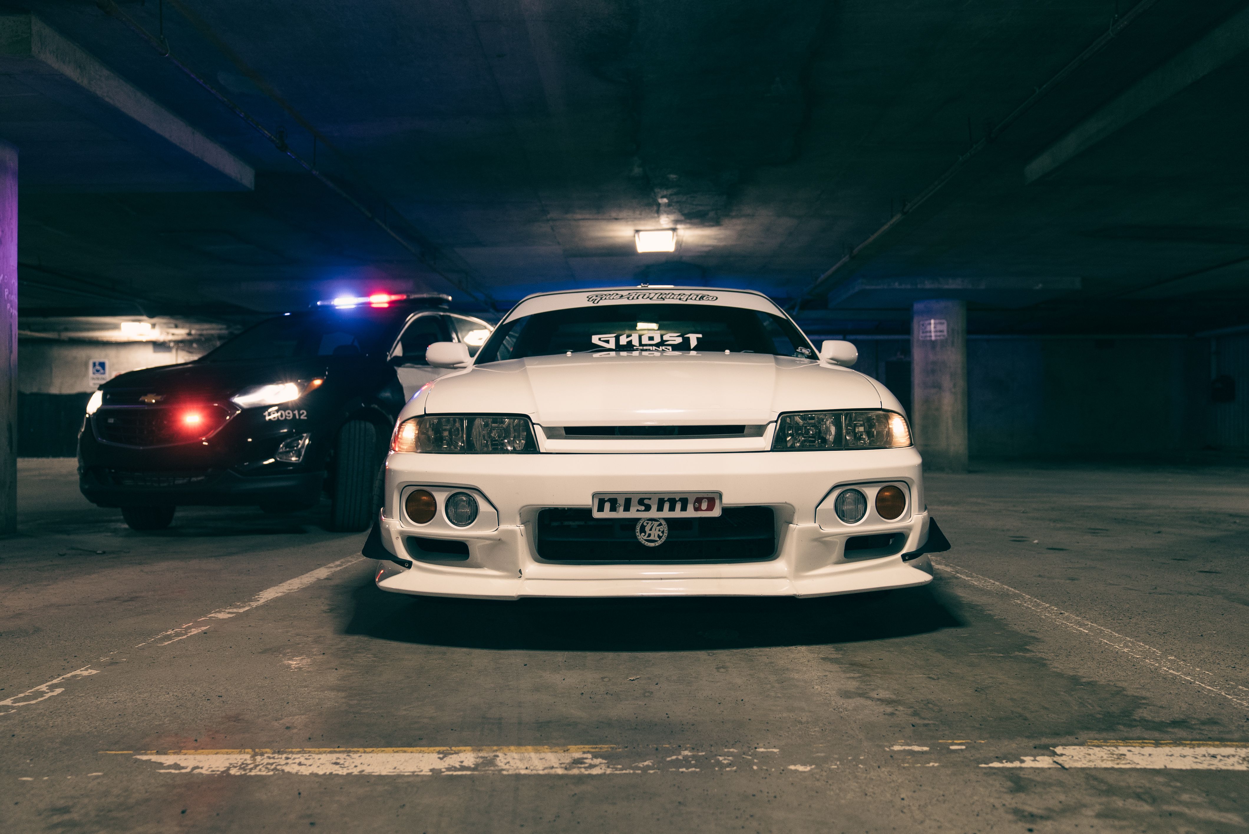 A police car parked in a parking garage · Free Stock Photo