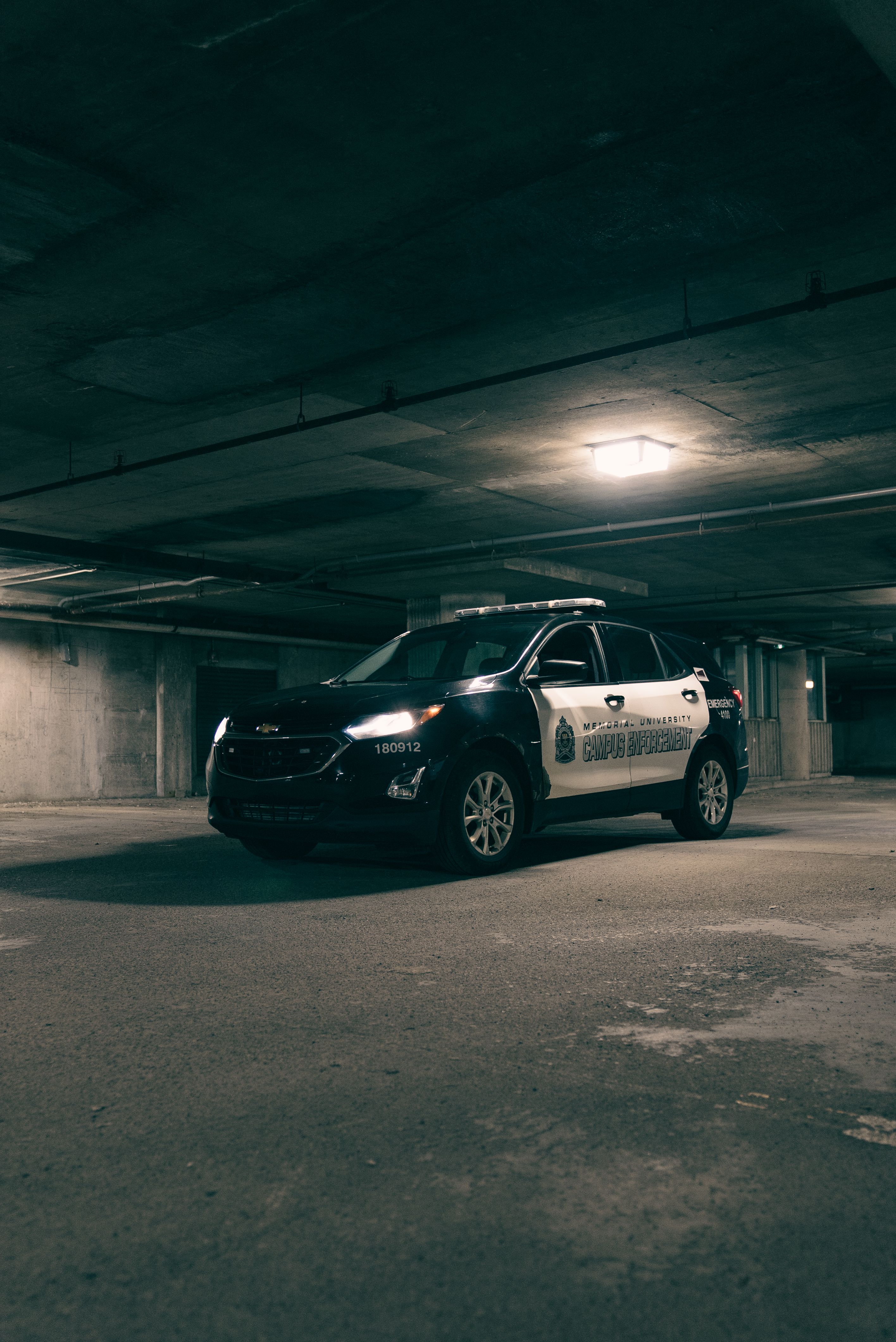 A police car parked in a parking garage · Free Stock Photo