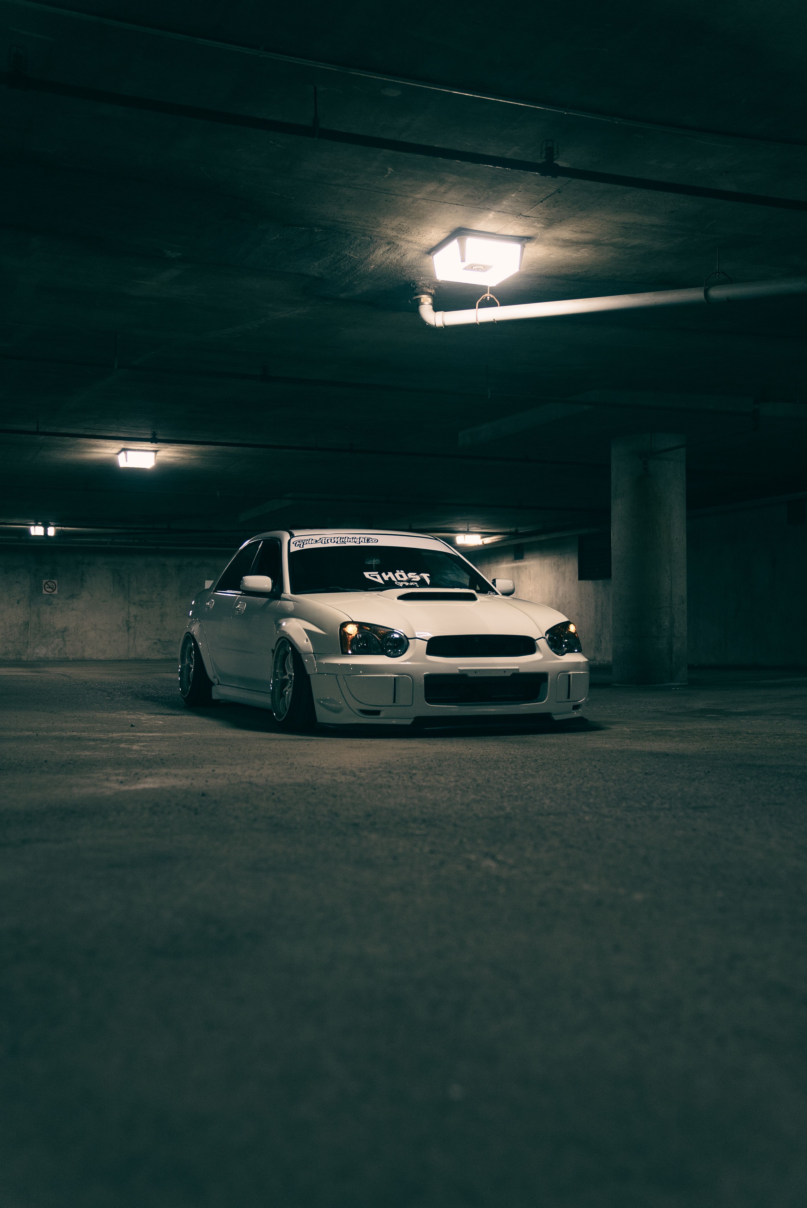 White Cars in Garage · Free Stock Photo