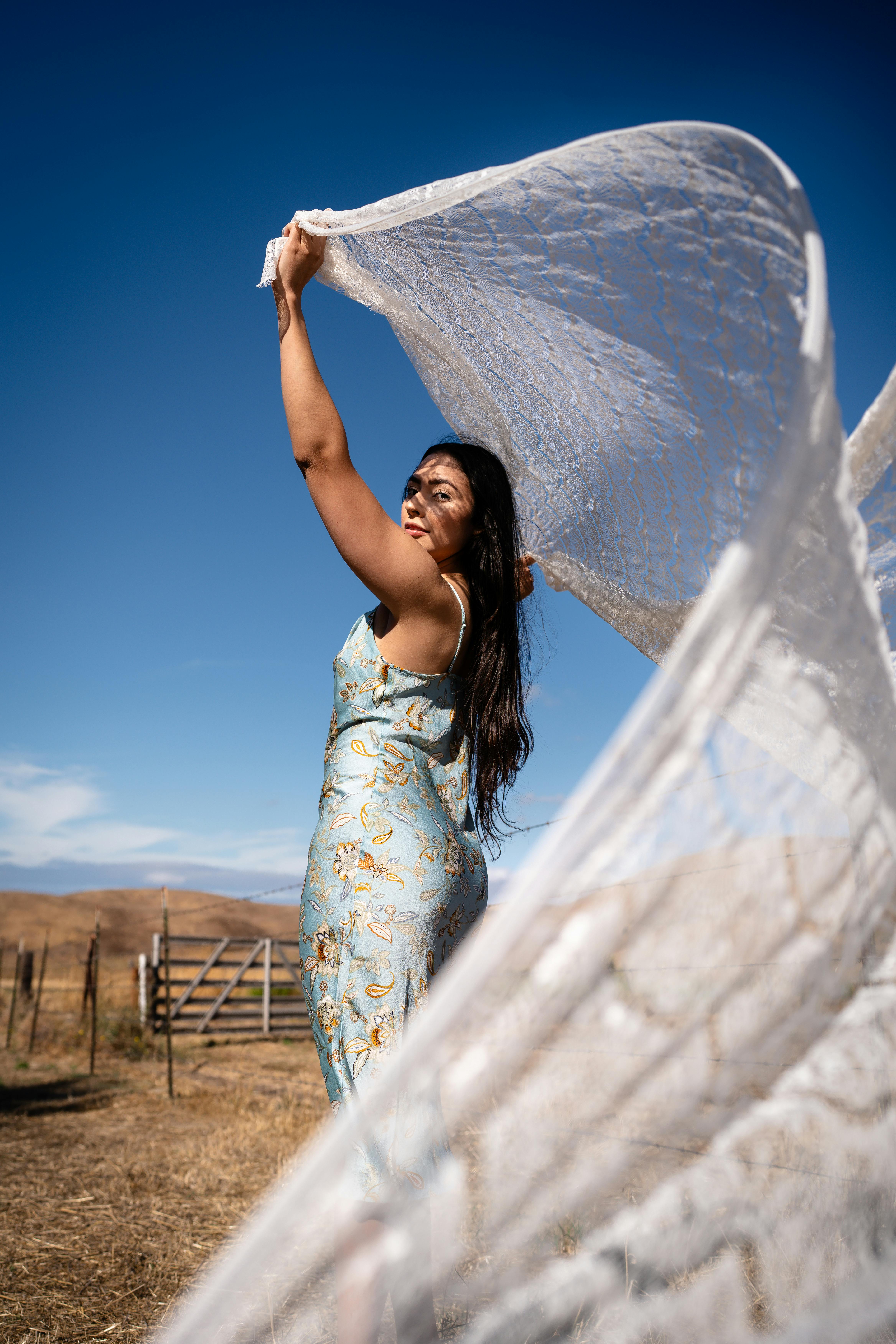 Woman Holding Scarf in Wind · Free Stock Photo