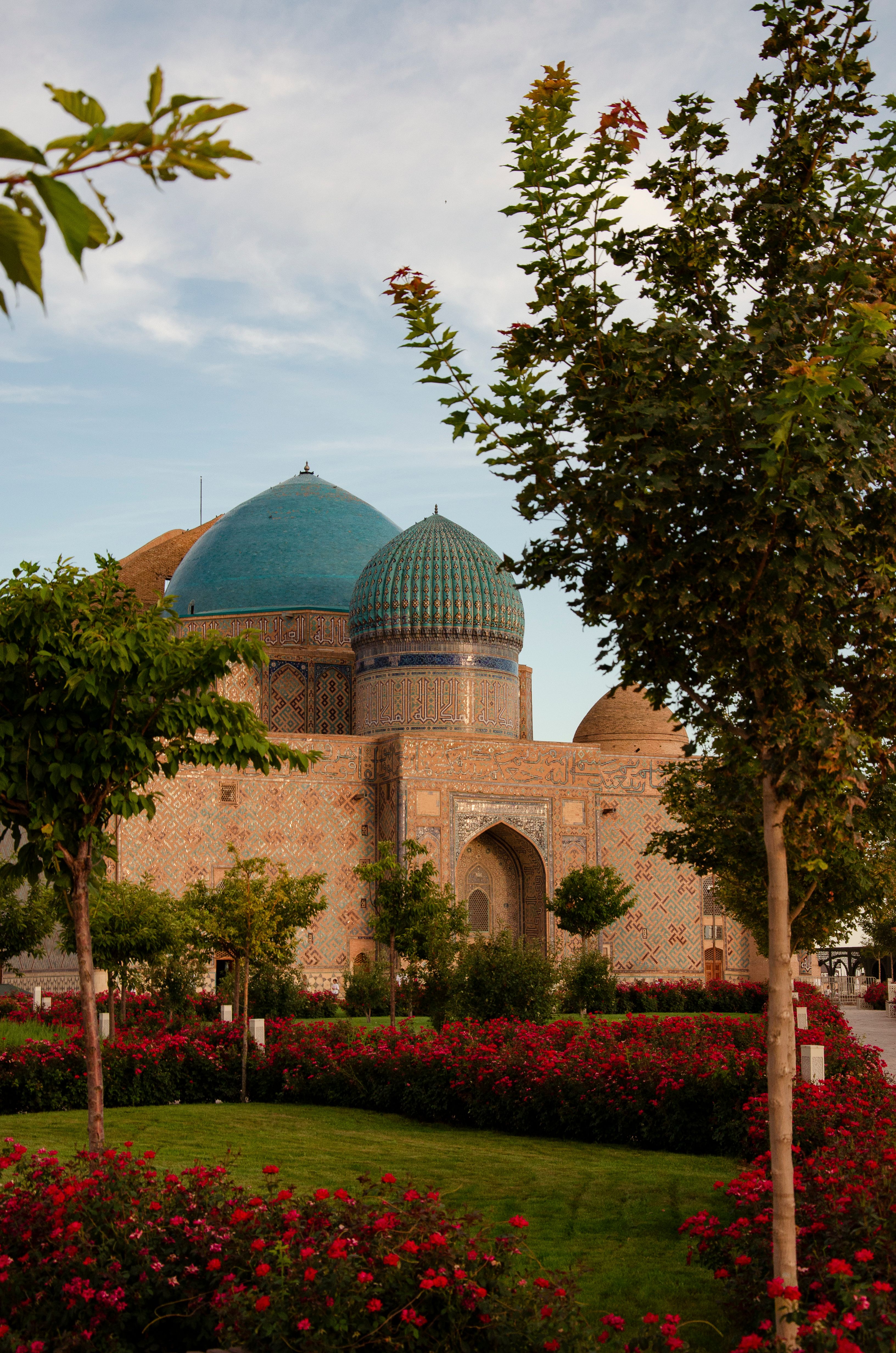A mosque with a blue dome and green trees · Free Stock Photo