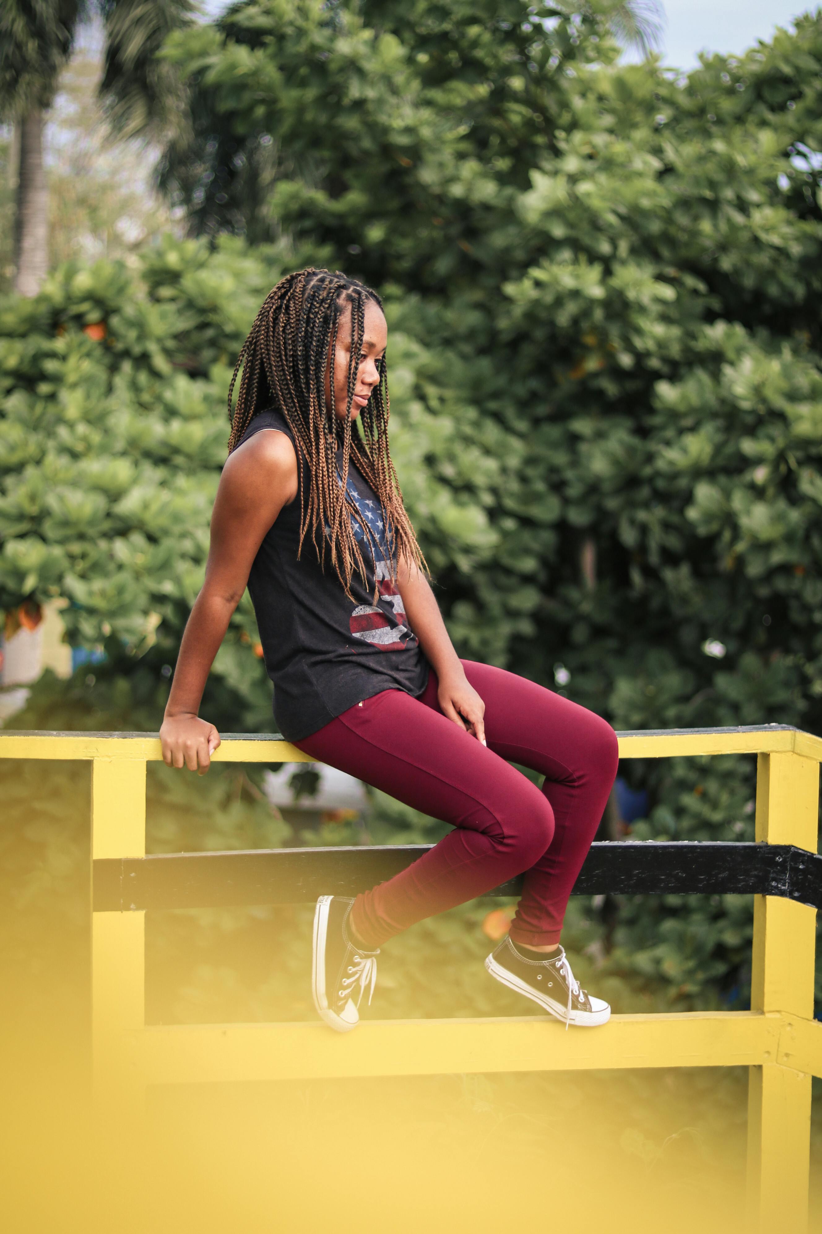 Girl Sitting On A Wooden Handrail · Free Stock Photo
