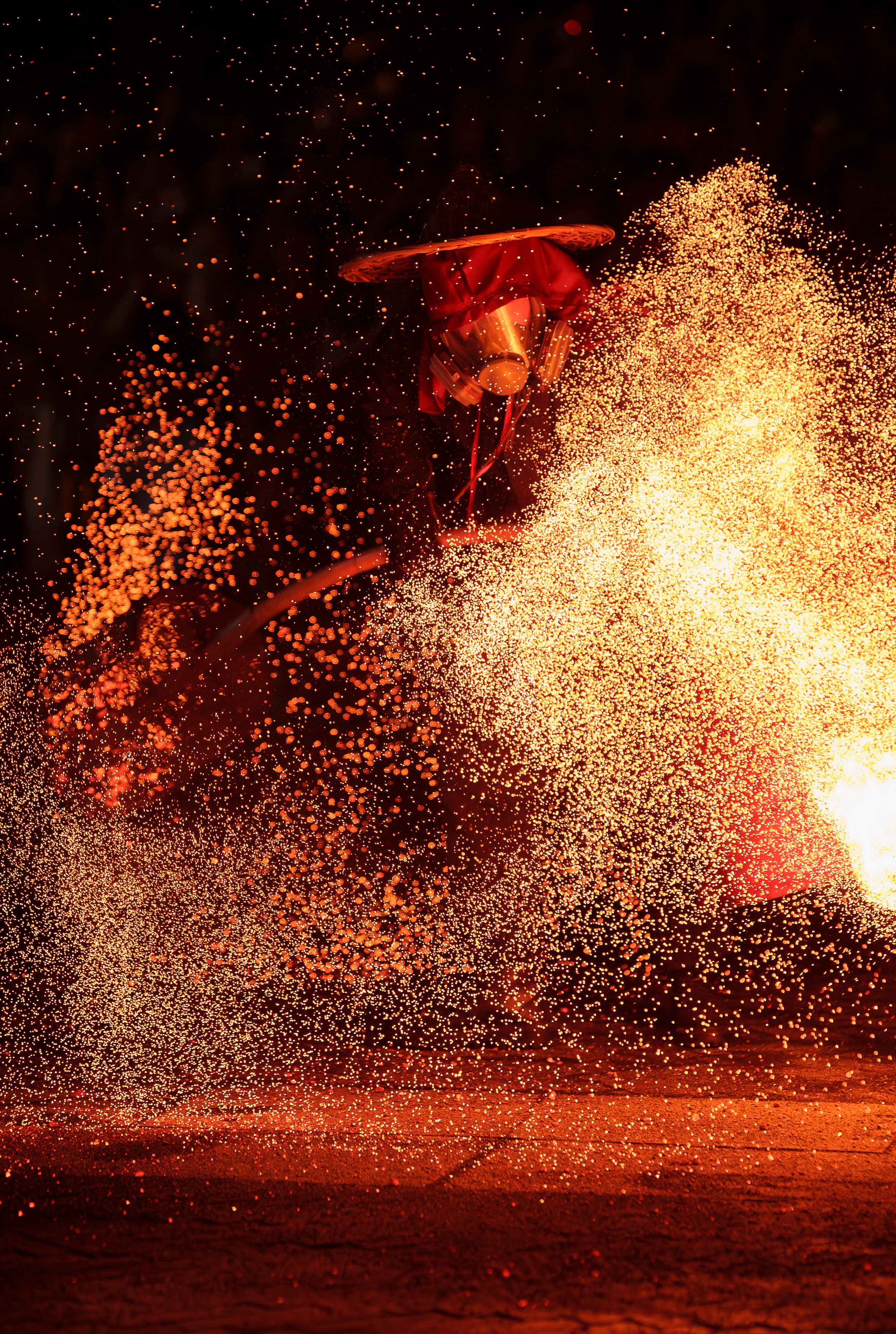 A man is throwing fire into the air · Free Stock Photo