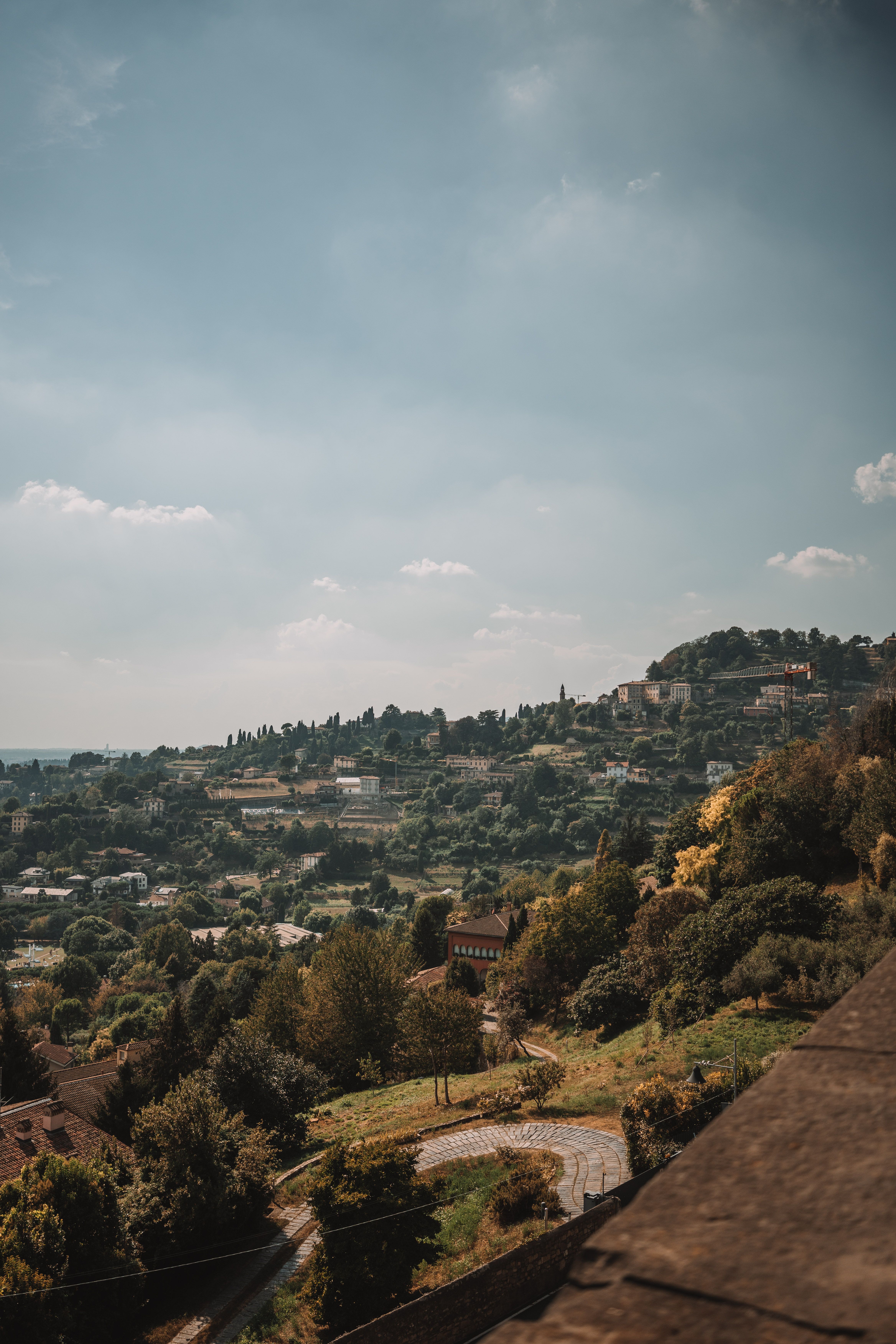 A view of a town and hills from a hilltop · Free Stock Photo