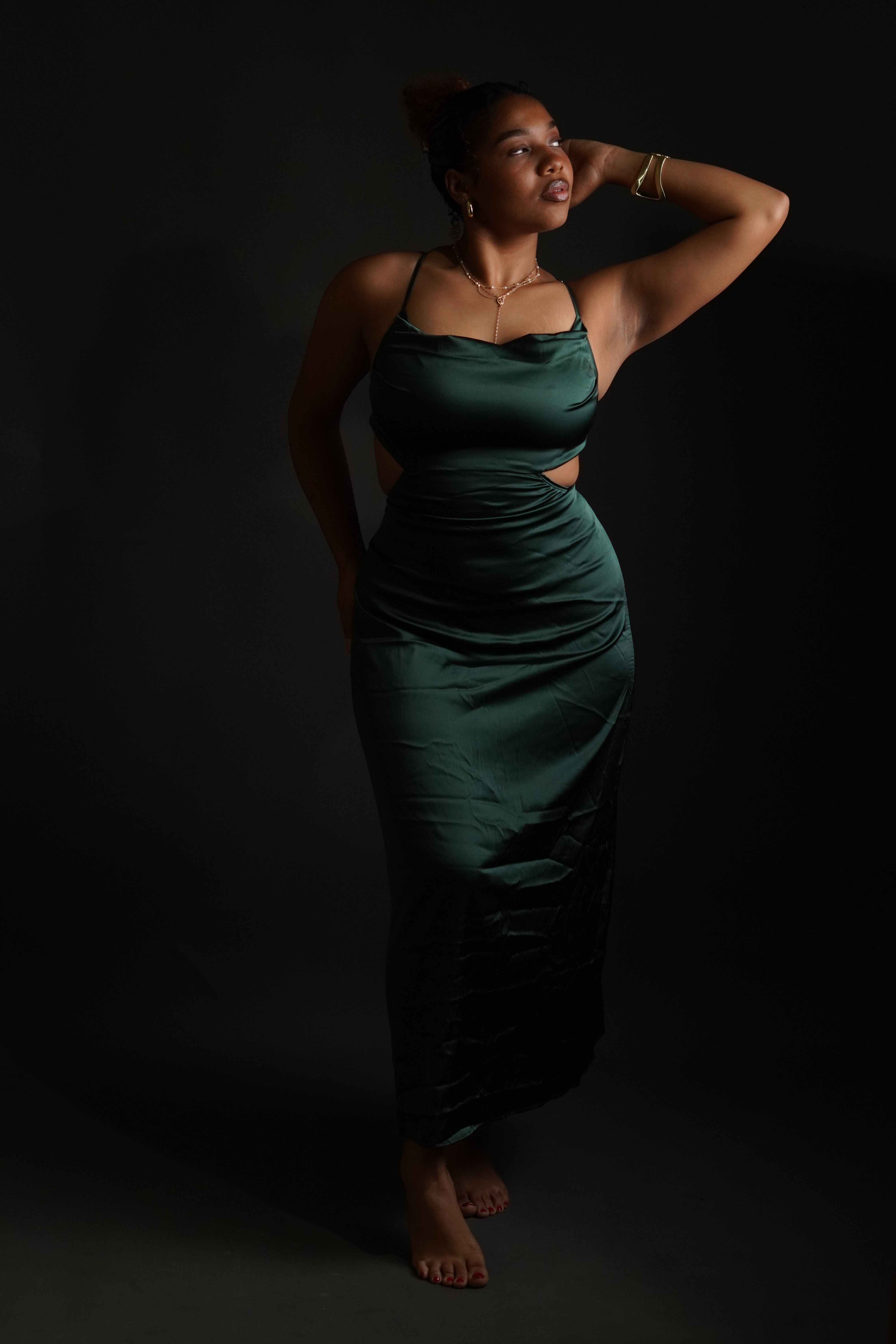 A woman in a green dress poses for a photo · Free Stock Photo