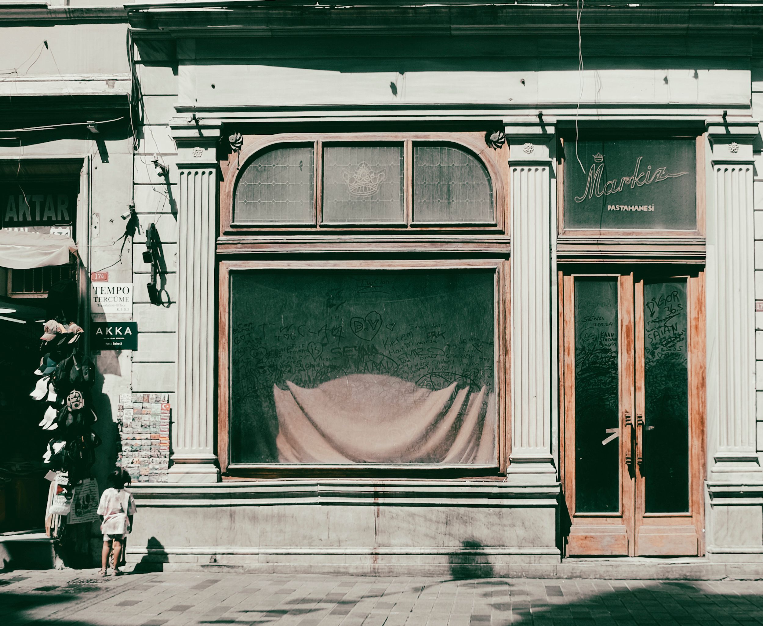 An old photo of a storefront with a window · Free Stock Photo