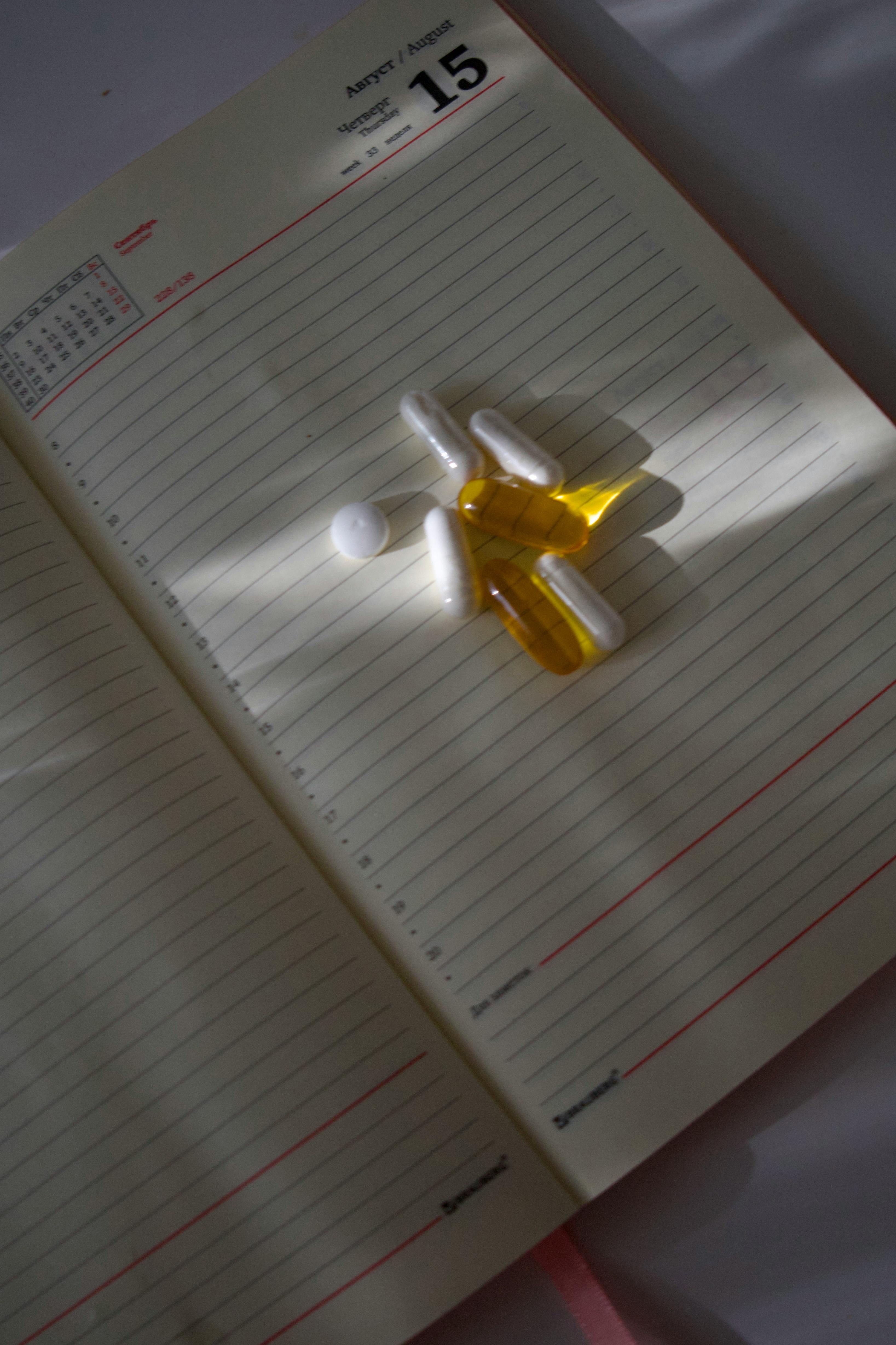 A small yellow object on top of a book · Free Stock Photo