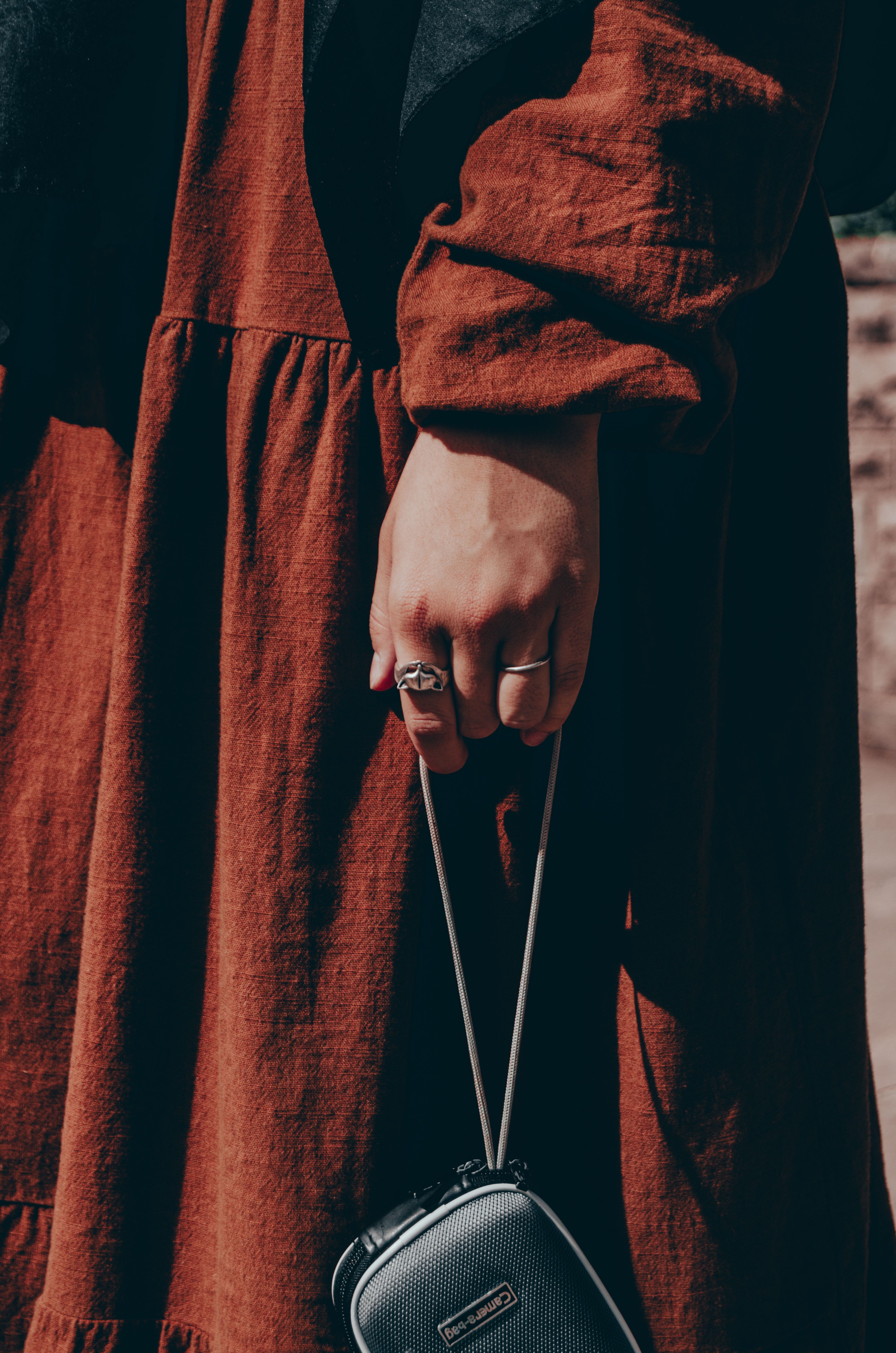 Hand Holding a Camera Case · Free Stock Photo