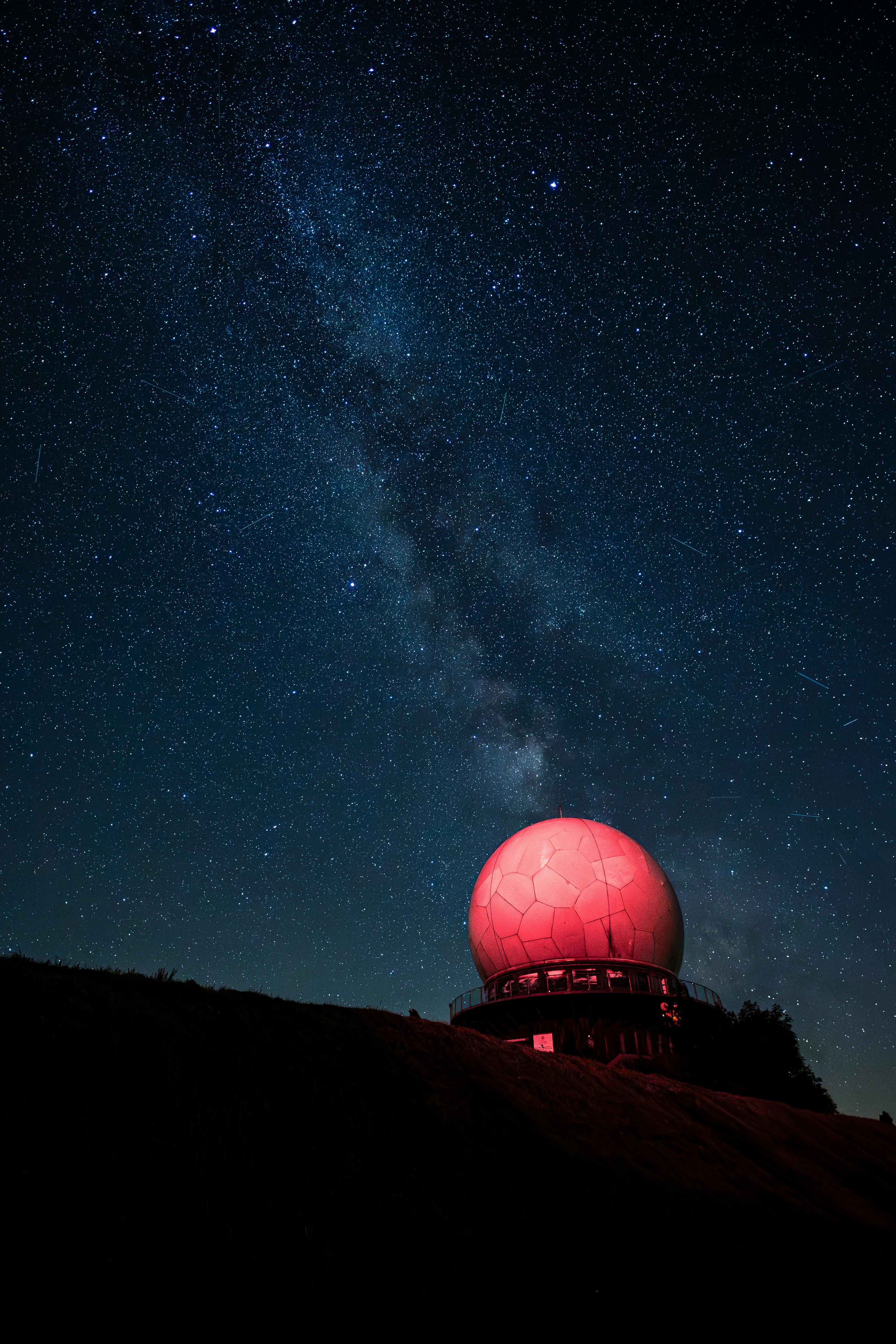 Red-Lit Observatory Against the Starry Night Sky · Free Stock Photo