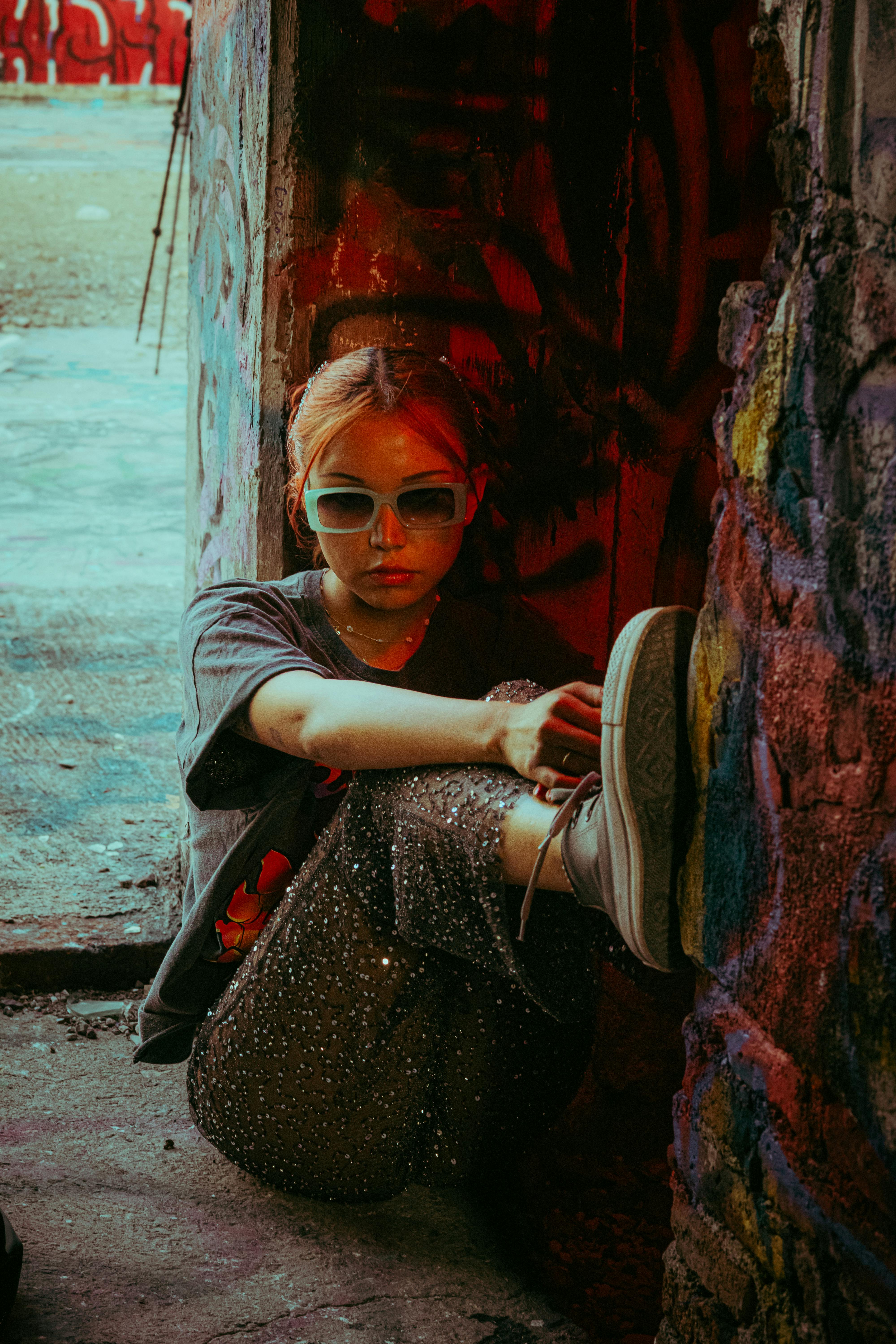 Urban Youth in Graffiti Alleyway Setting · Free Stock Photo