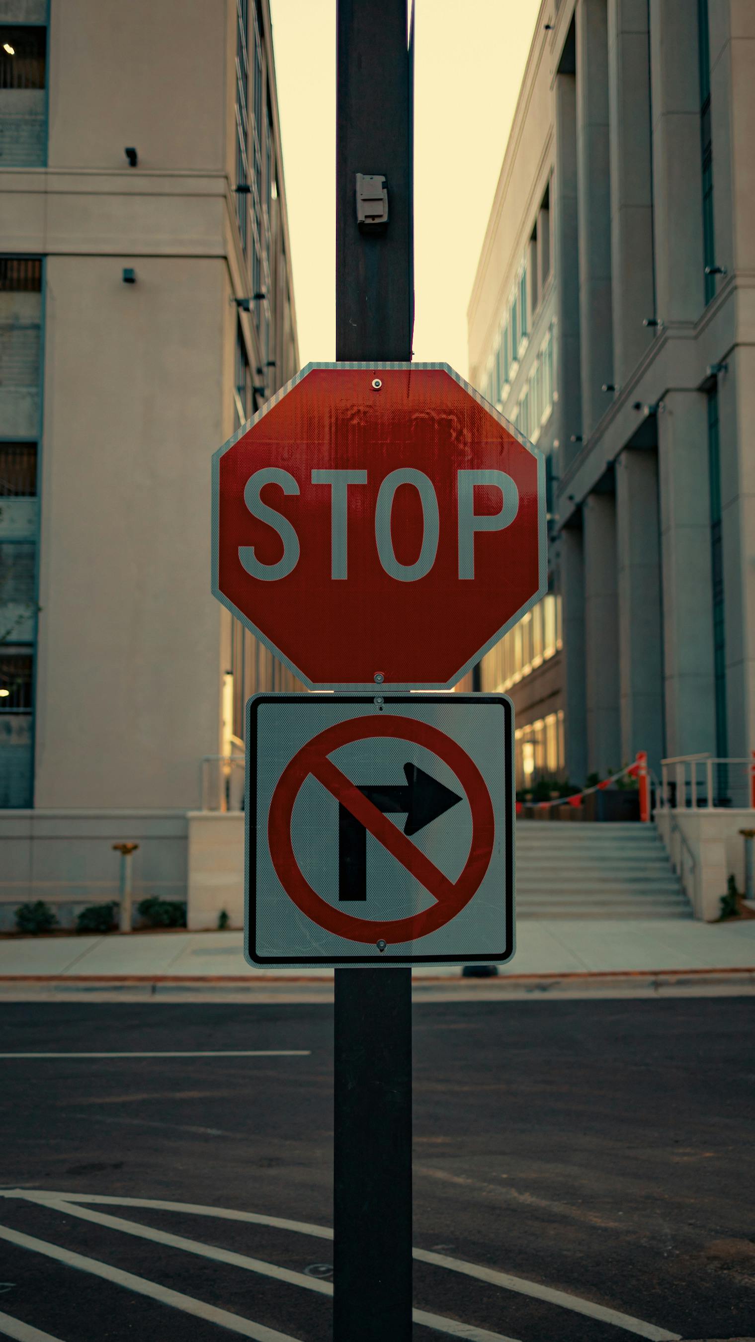 A stop sign with a no turn sign on it · Free Stock Photo