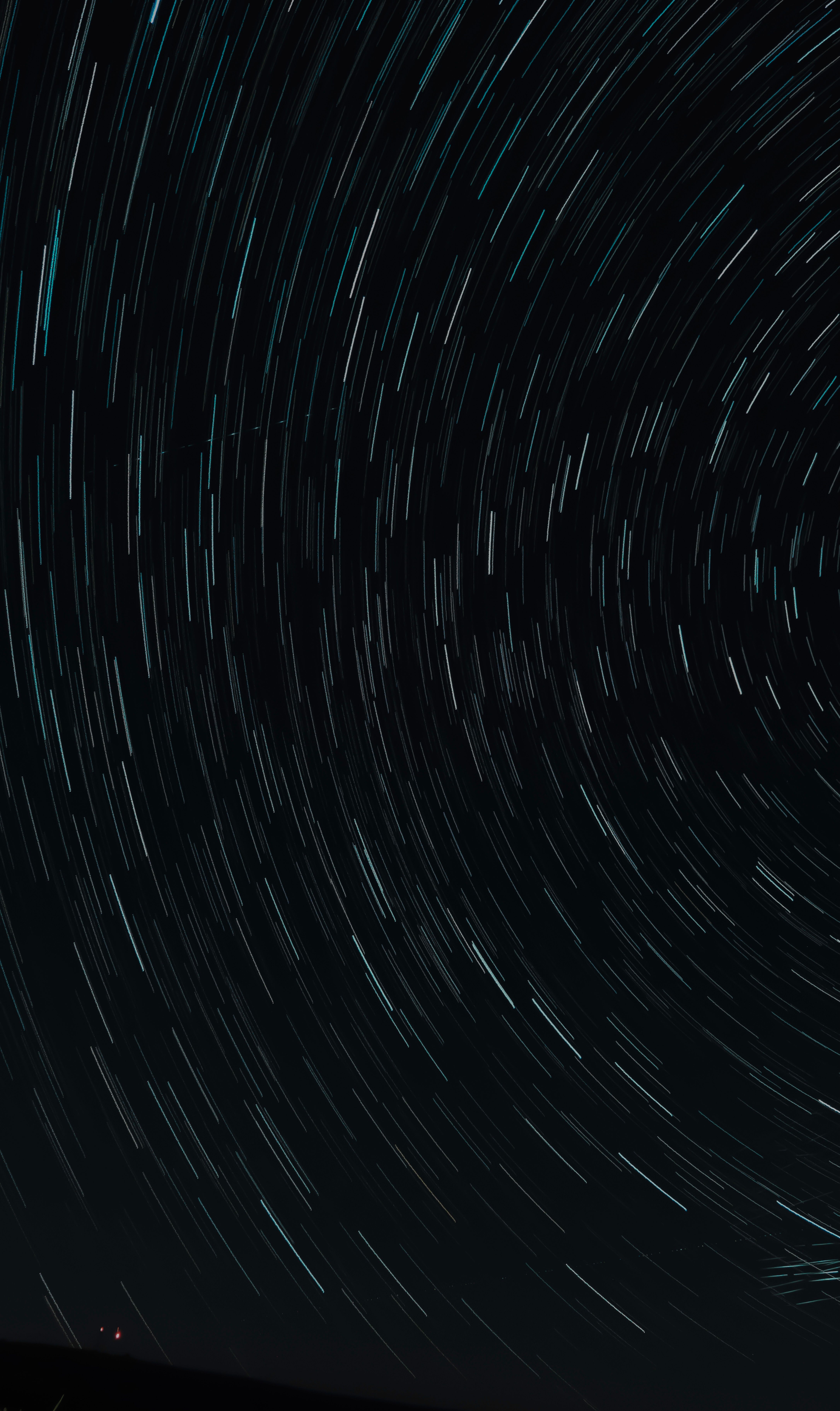 Star trails in the sky on a dark background · Free Stock Photo