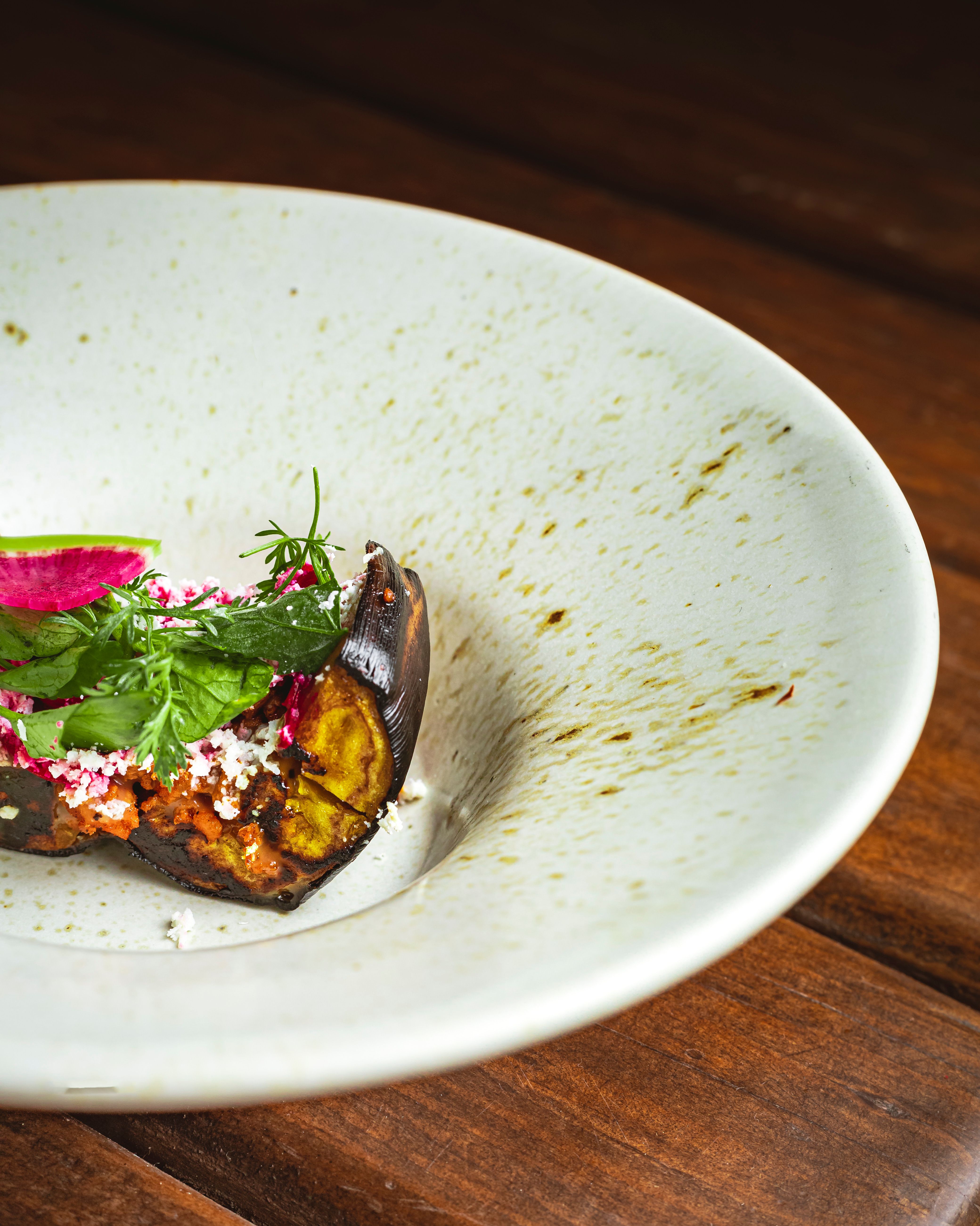A white plate with a dish of food on it · Free Stock Photo