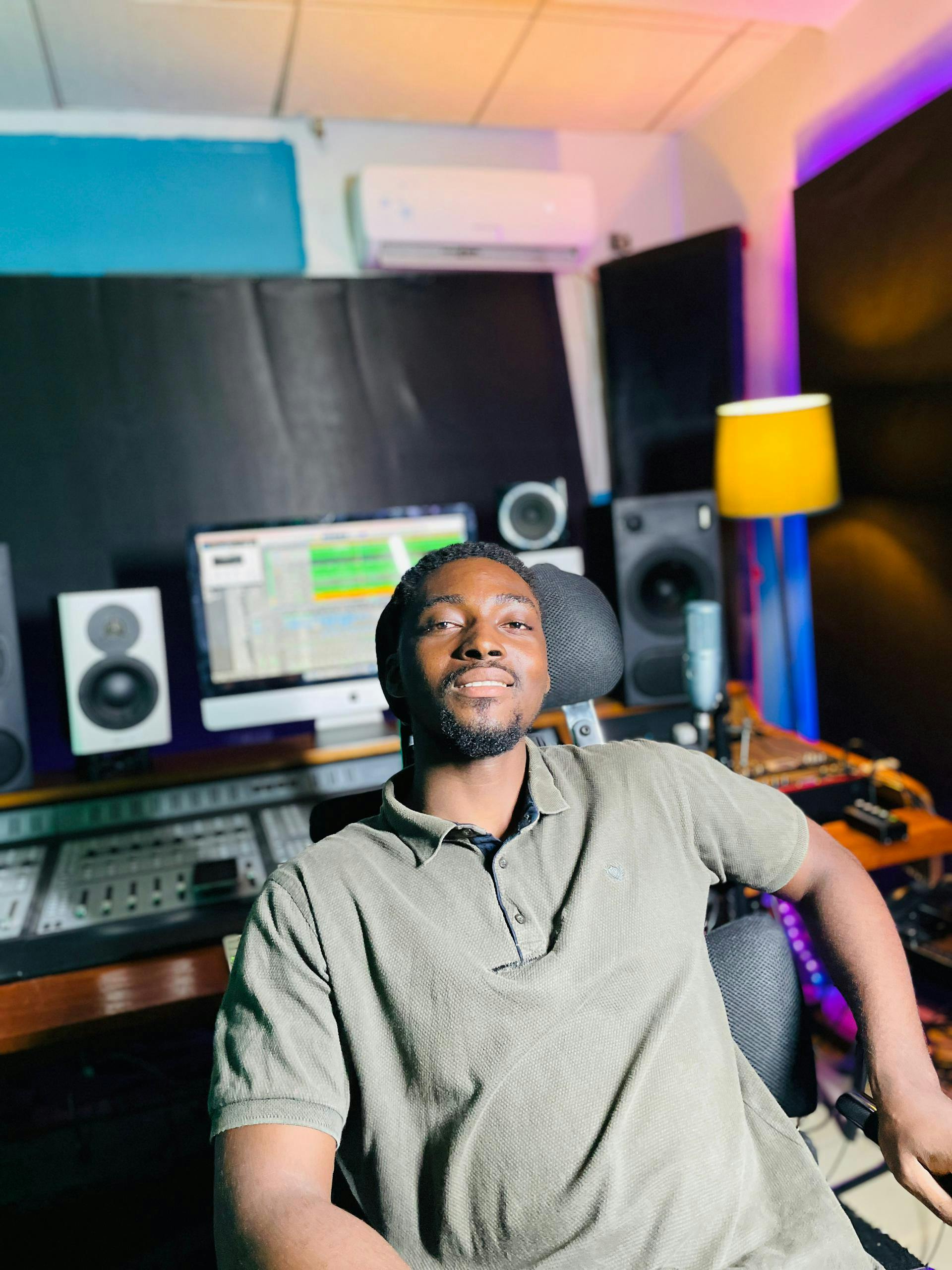 A man sitting in front of a recording studio · Free Stock Photo