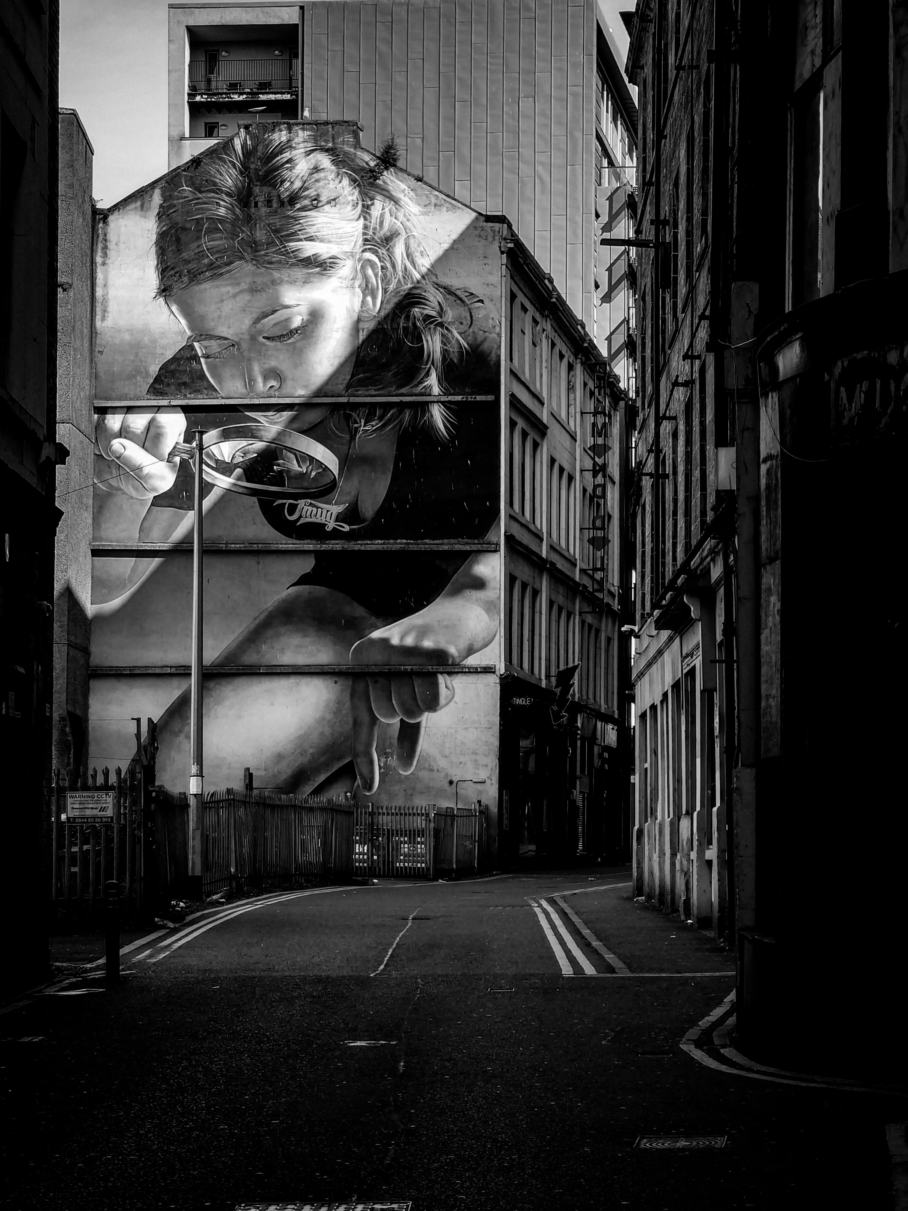 A black and white photo of a woman walking down the street · Free Stock ...