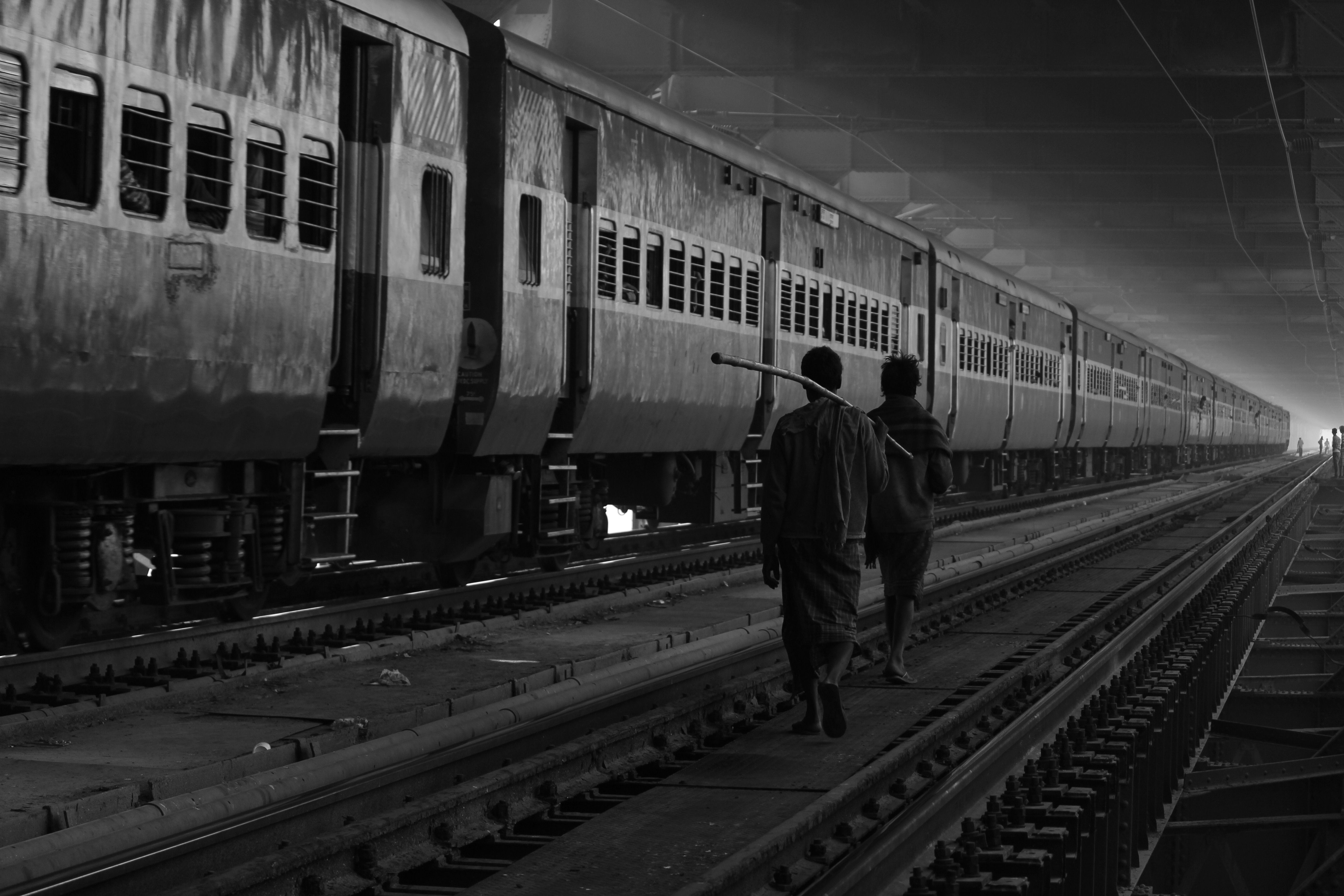 Two men walking on the platform of a train · Free Stock Photo