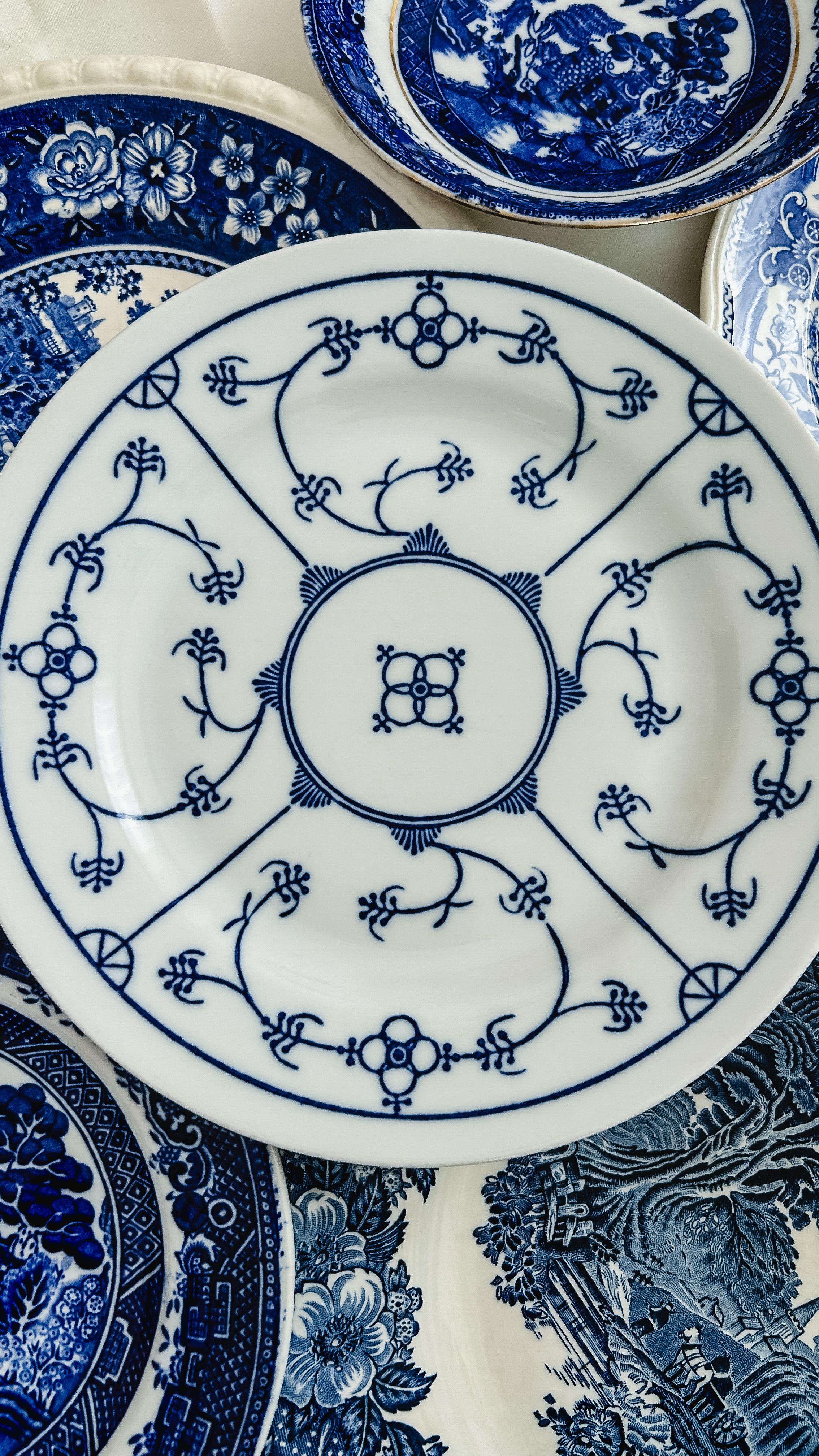 A collection of blue and white plates with designs · Free Stock Photo