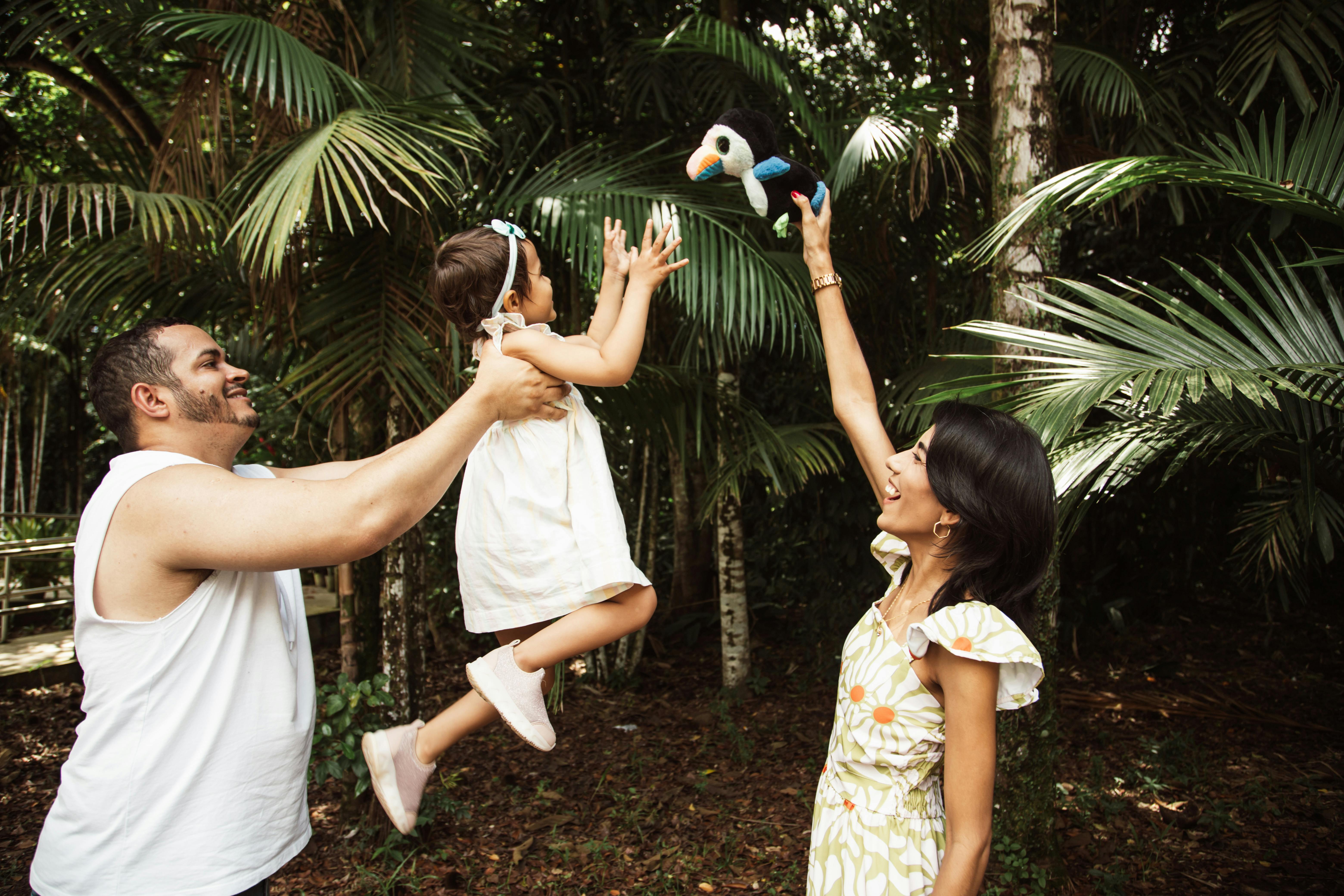 A family is playing with a toy in the jungle · Free Stock Photo
