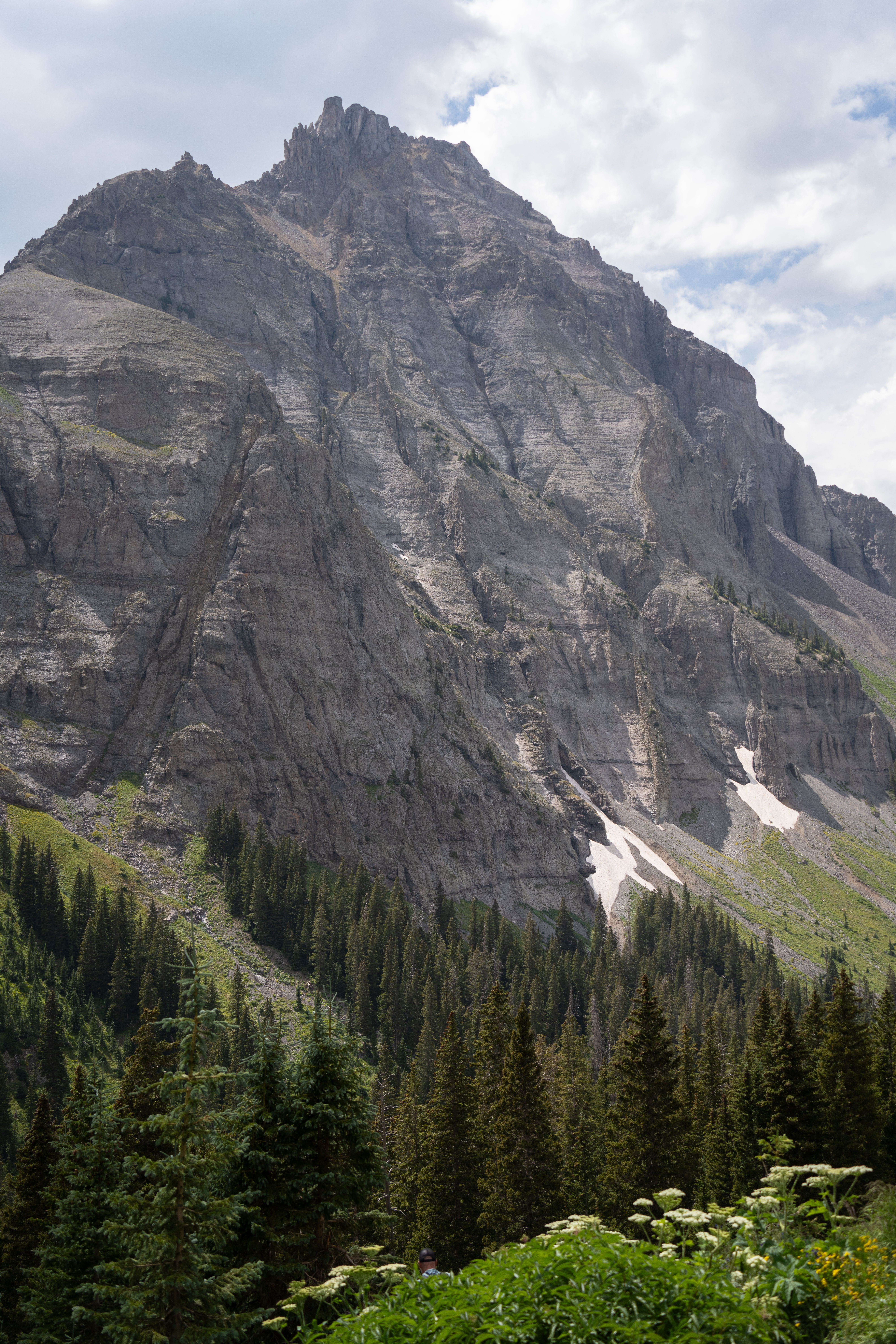A mountain with a large rock formation in the background · Free Stock Photo