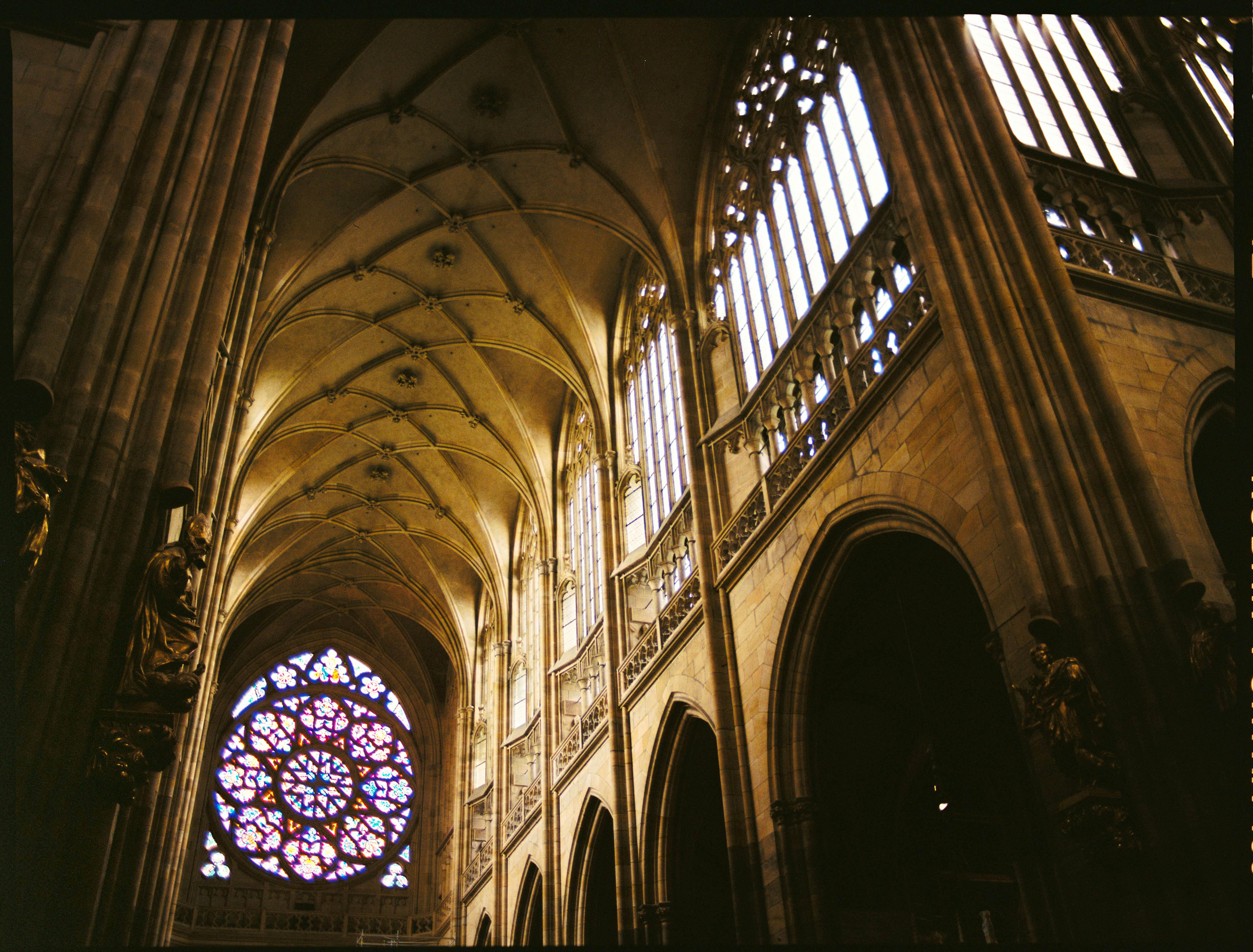 A cathedral with stained glass windows and a large stained glass window ...