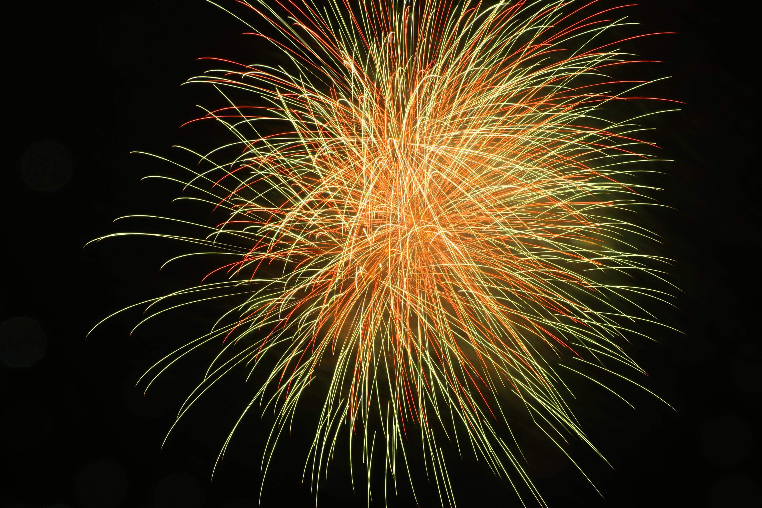 Silhouette of Person in Front of Fireworks · Free Stock Photo