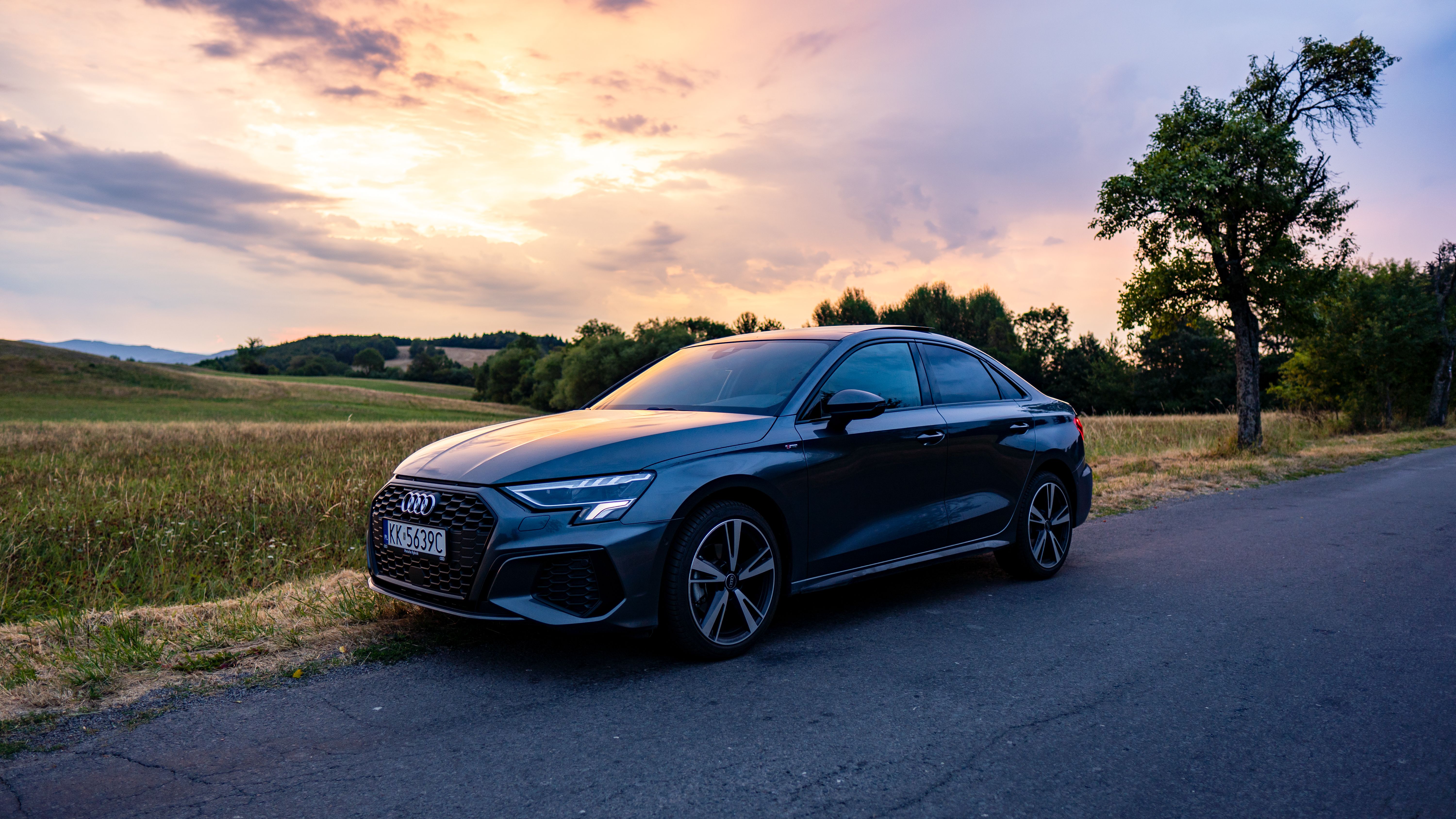 The audi a3 sedan parked on a road at sunset · Free Stock Photo