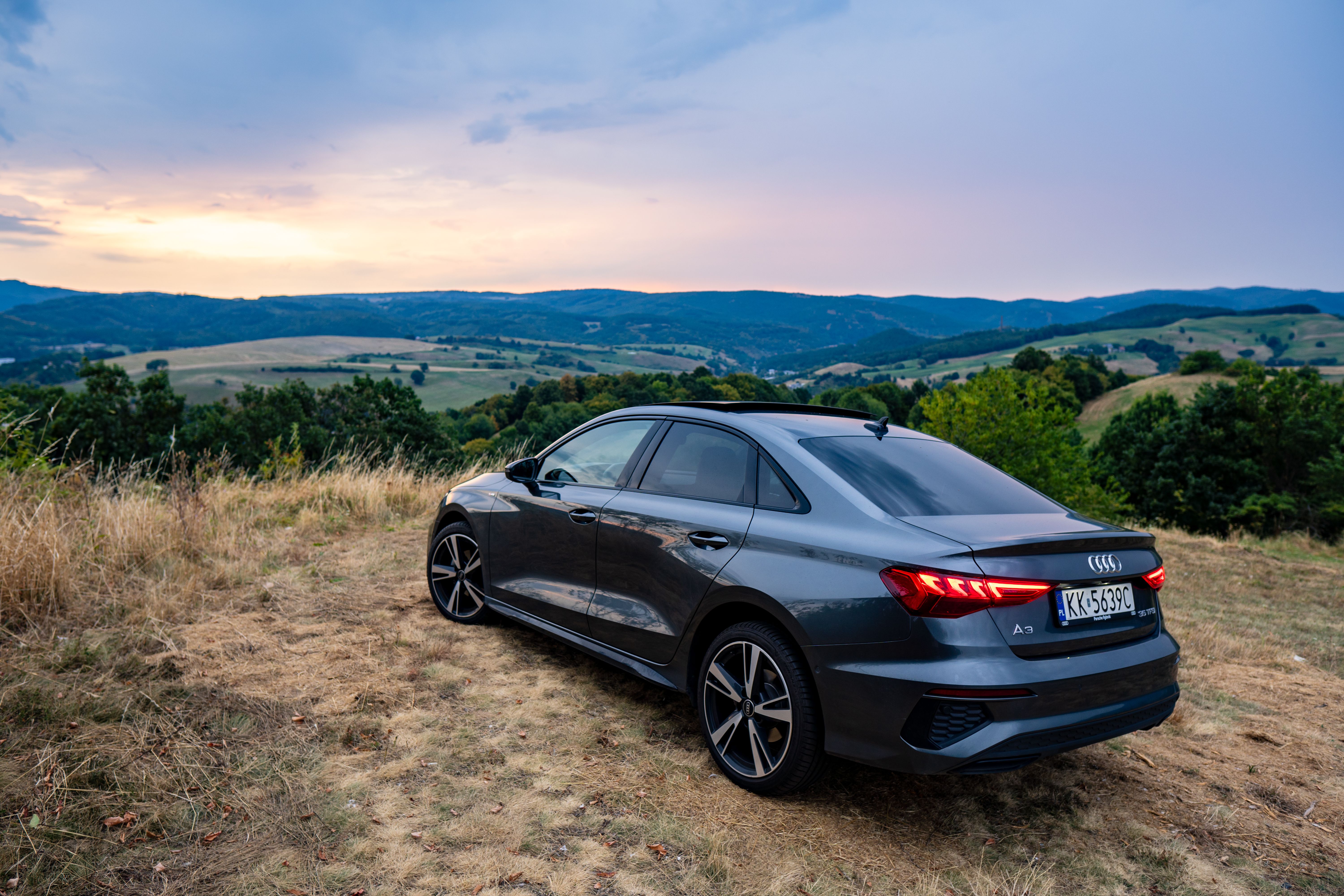 The back of a black audi parked on a hillside · Free Stock Photo