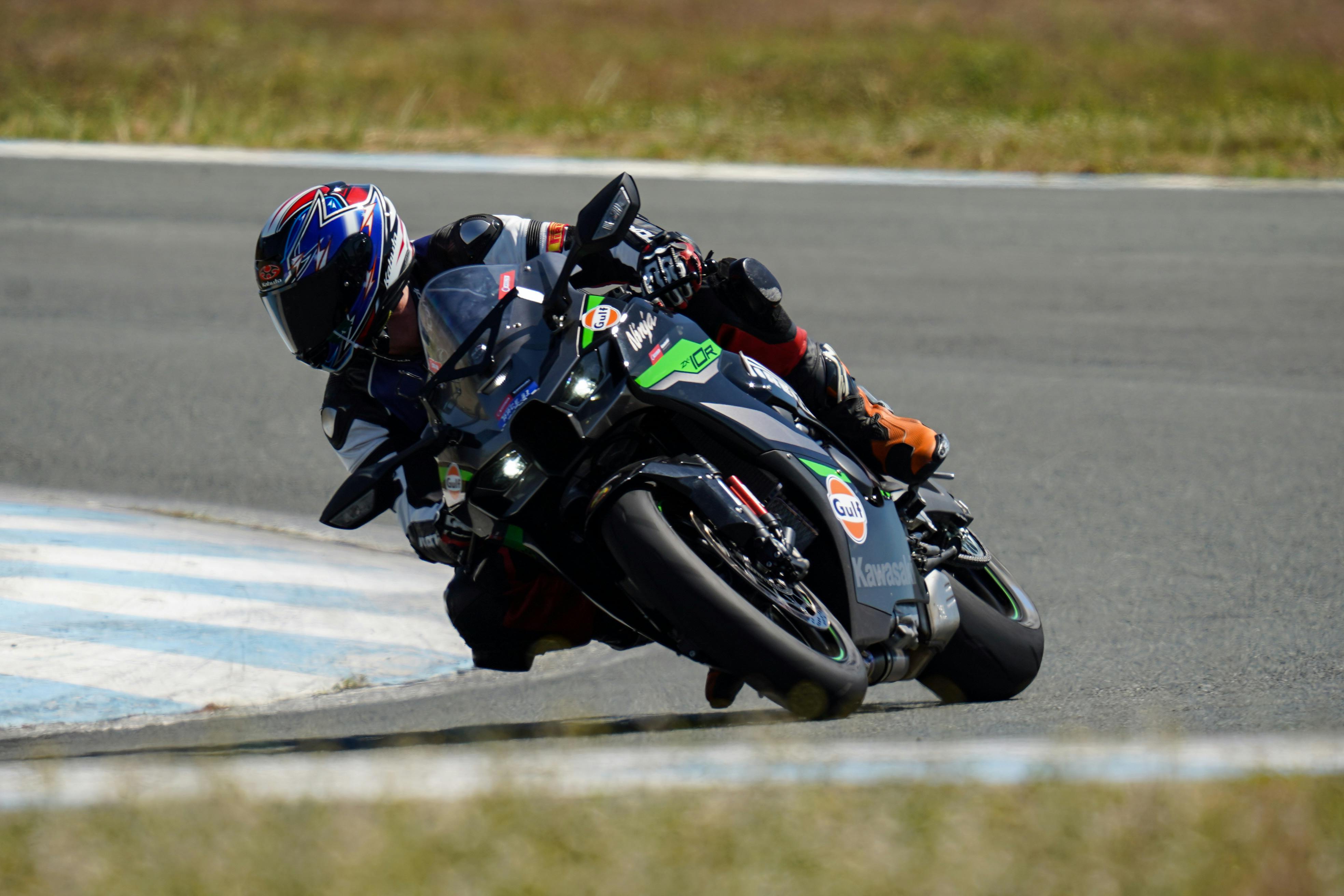 A Racer Riding His Motorcycle in the Race Track · Free Stock Photo