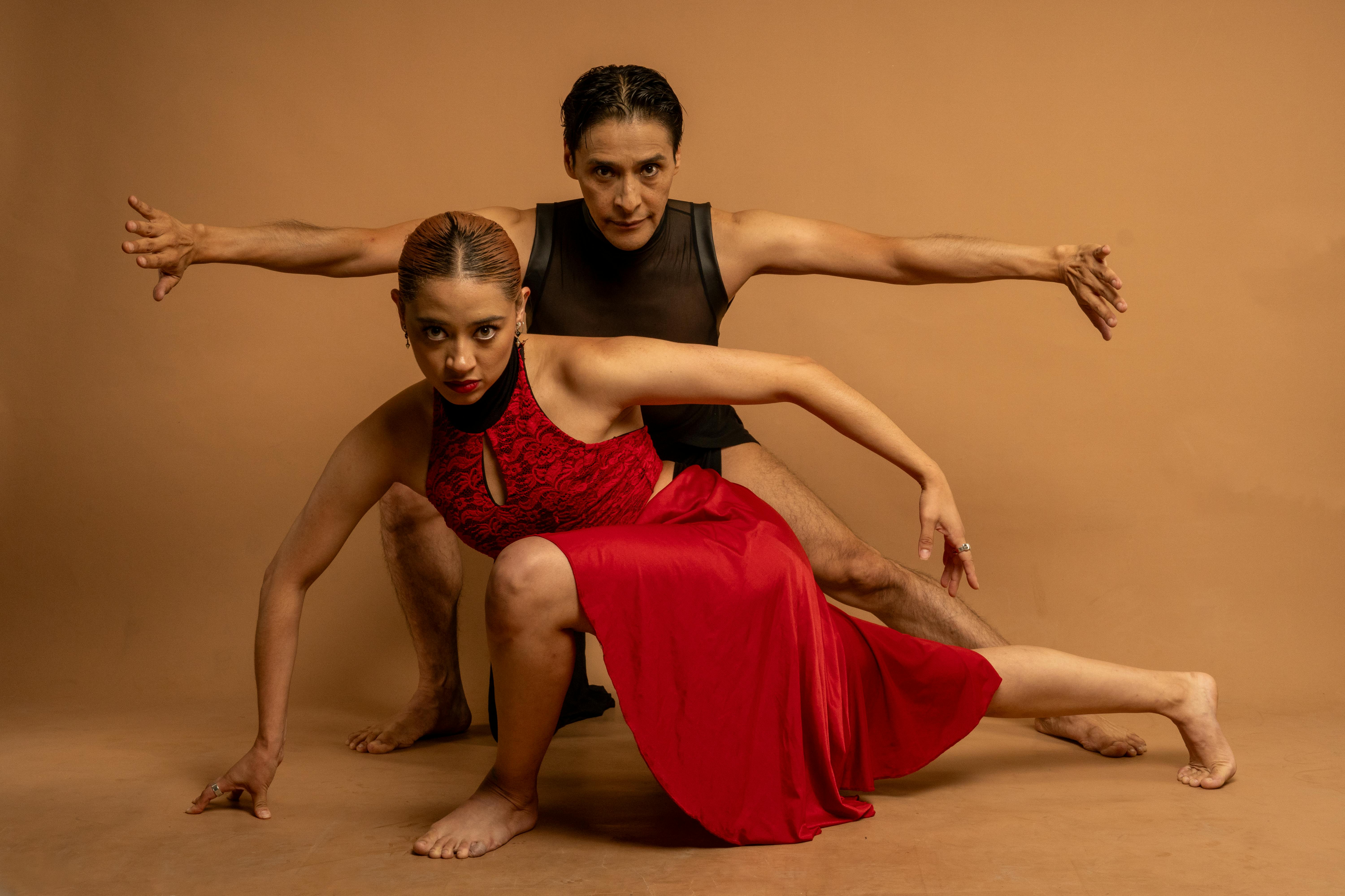 Two dancers in red dresses pose for a photo · Free Stock Photo