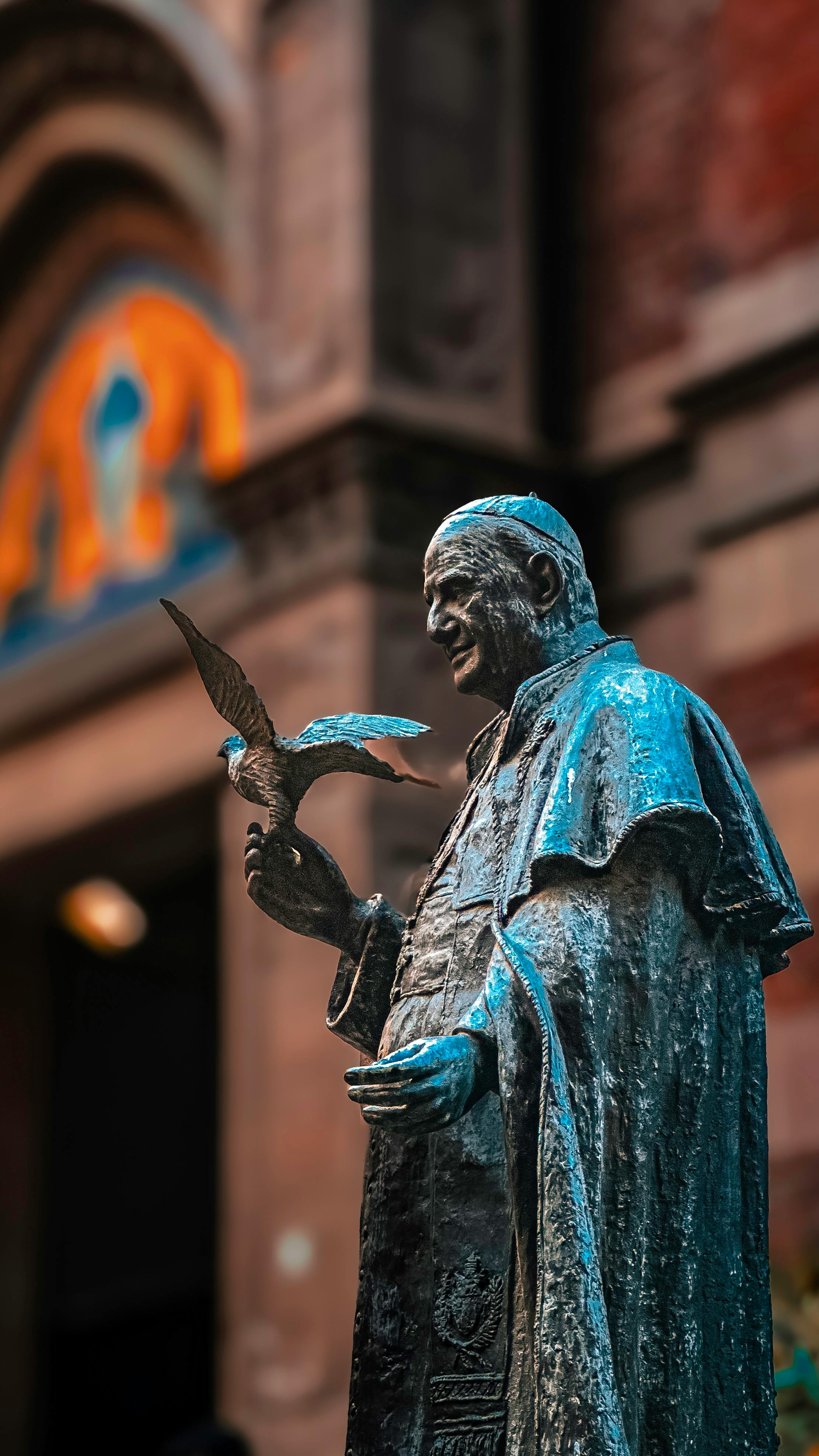 A statue of pope benedict holding a bird · Free Stock Photo