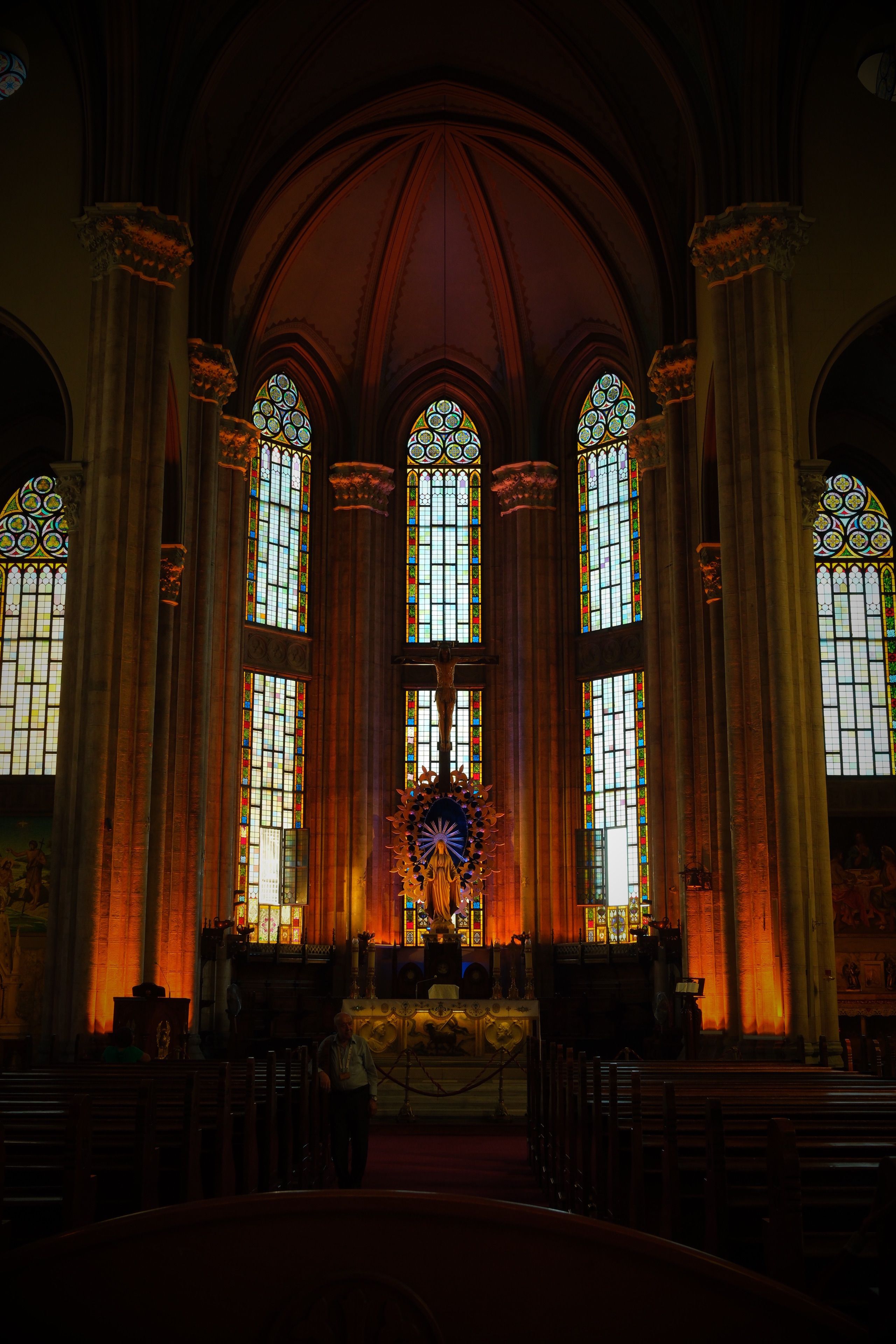 A church with stained glass windows and a large altar · Free Stock Photo