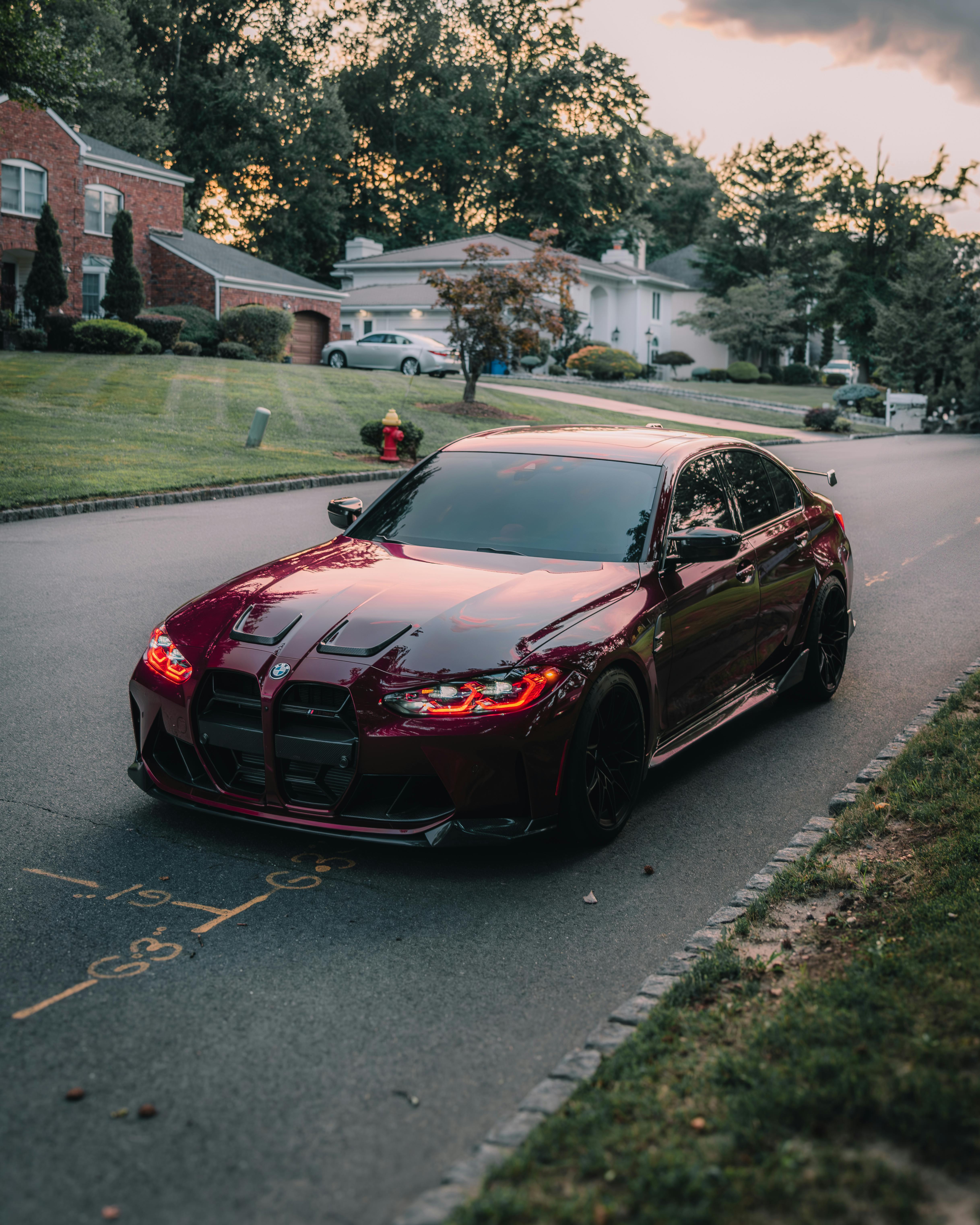 A red bmw m3 parked on the street · Free Stock Photo