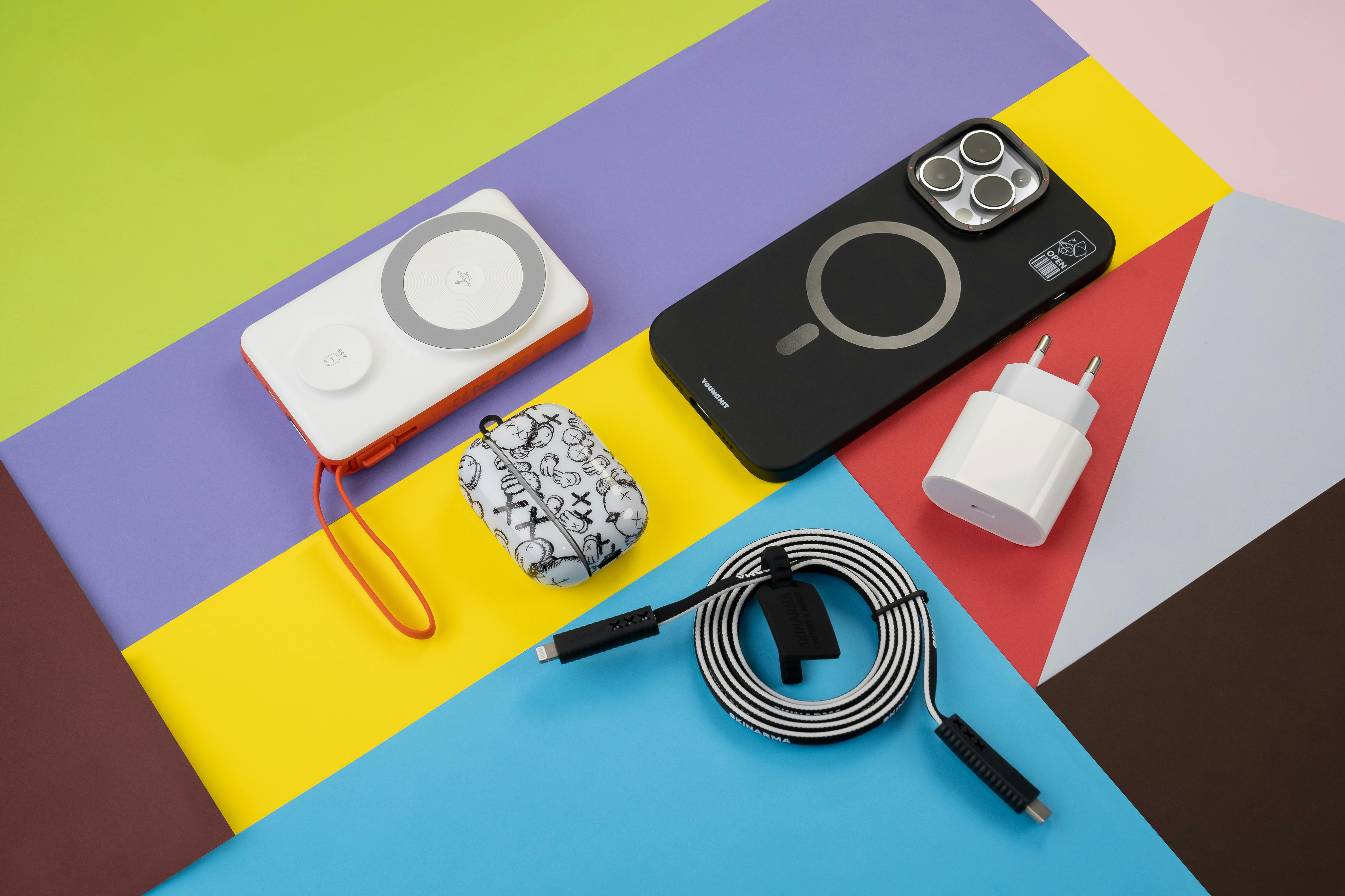 A variety of electronic devices on a colorful background · Free Stock Photo