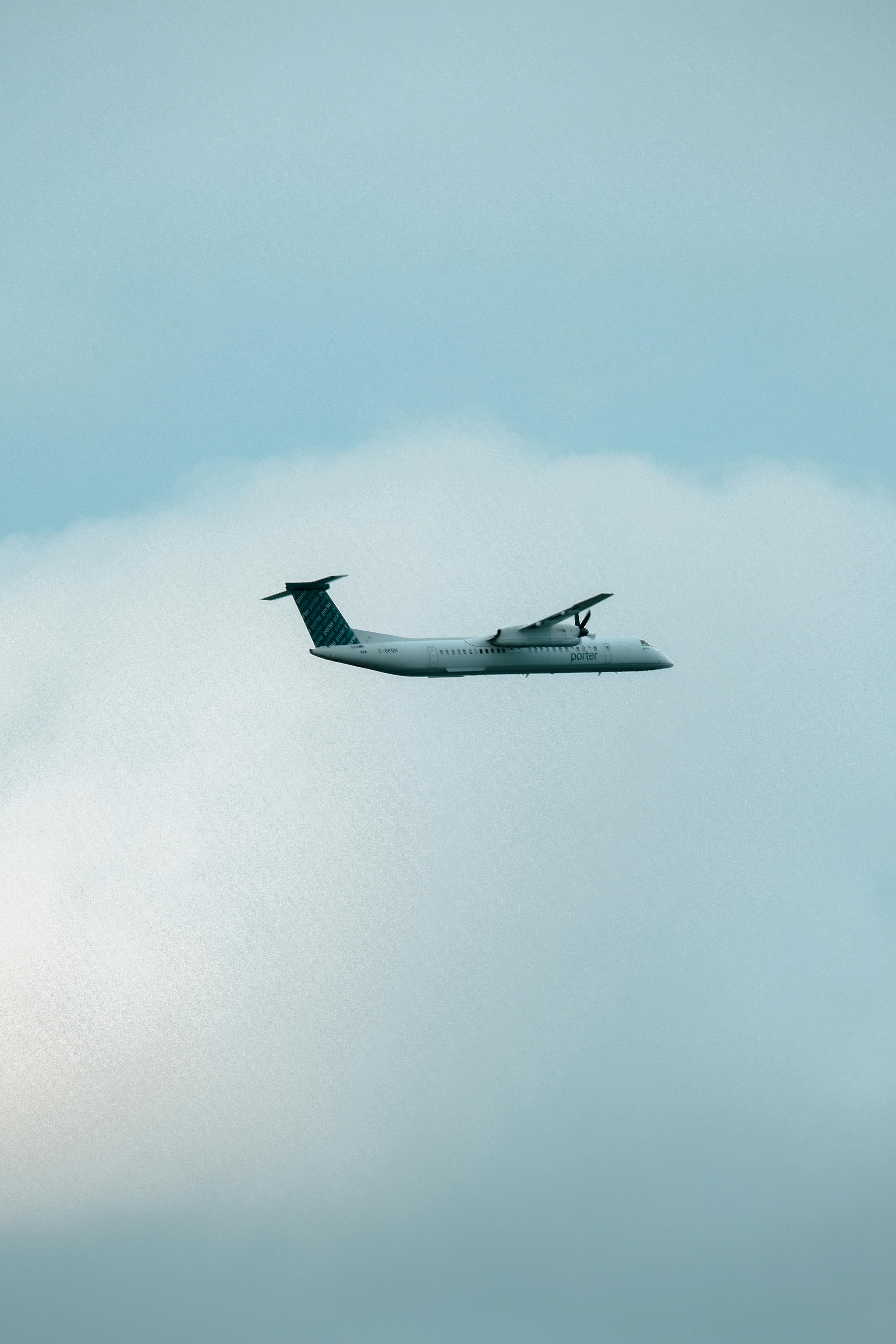 Private Jet Flying over the ocean · Free Stock Photo