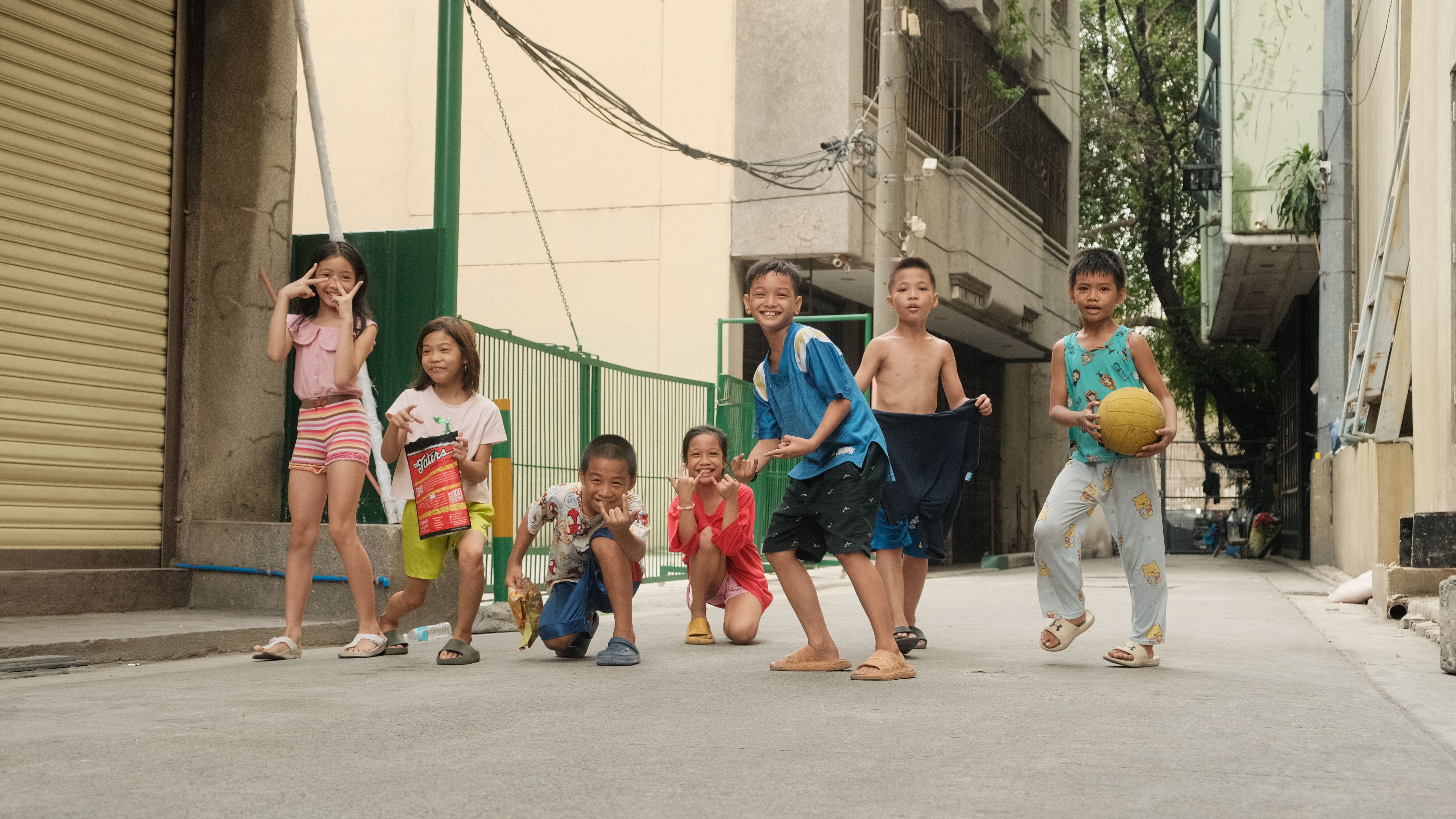 Children Playing Joyfully in Manila Street · Free Stock Photo