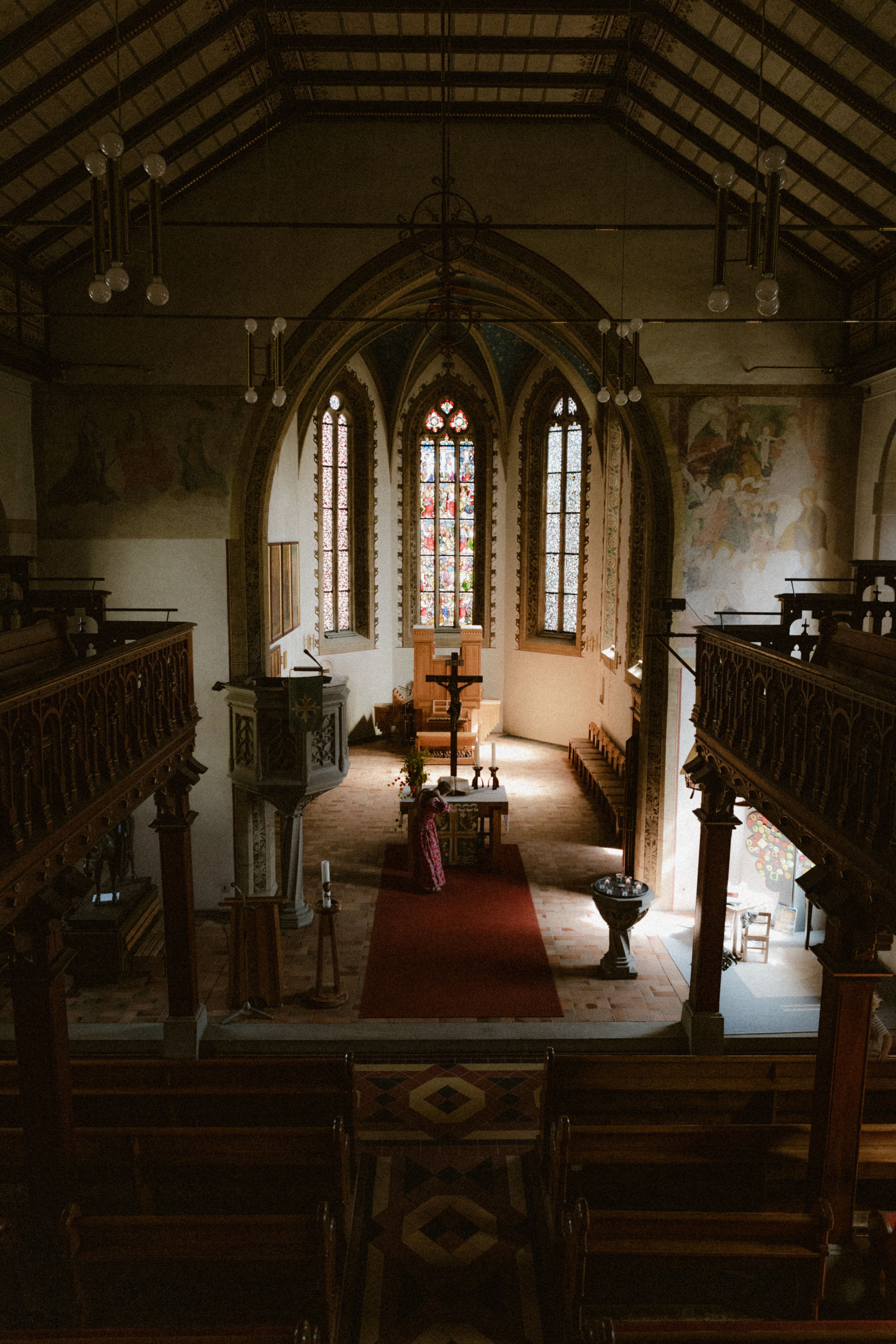 The inside of a church with a large wooden pew · Free Stock Photo