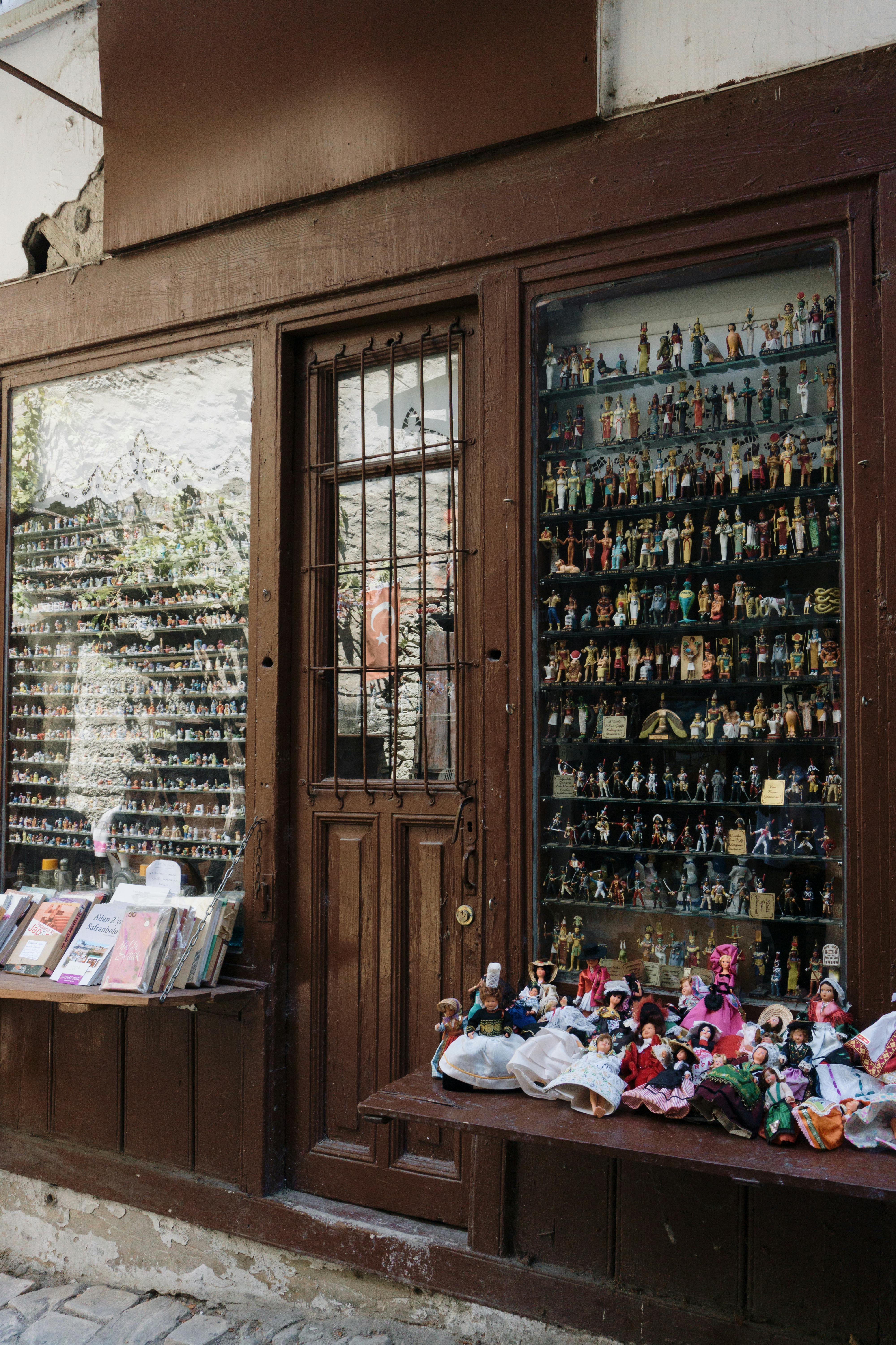 A shop with many dolls and toys on display · Free Stock Photo