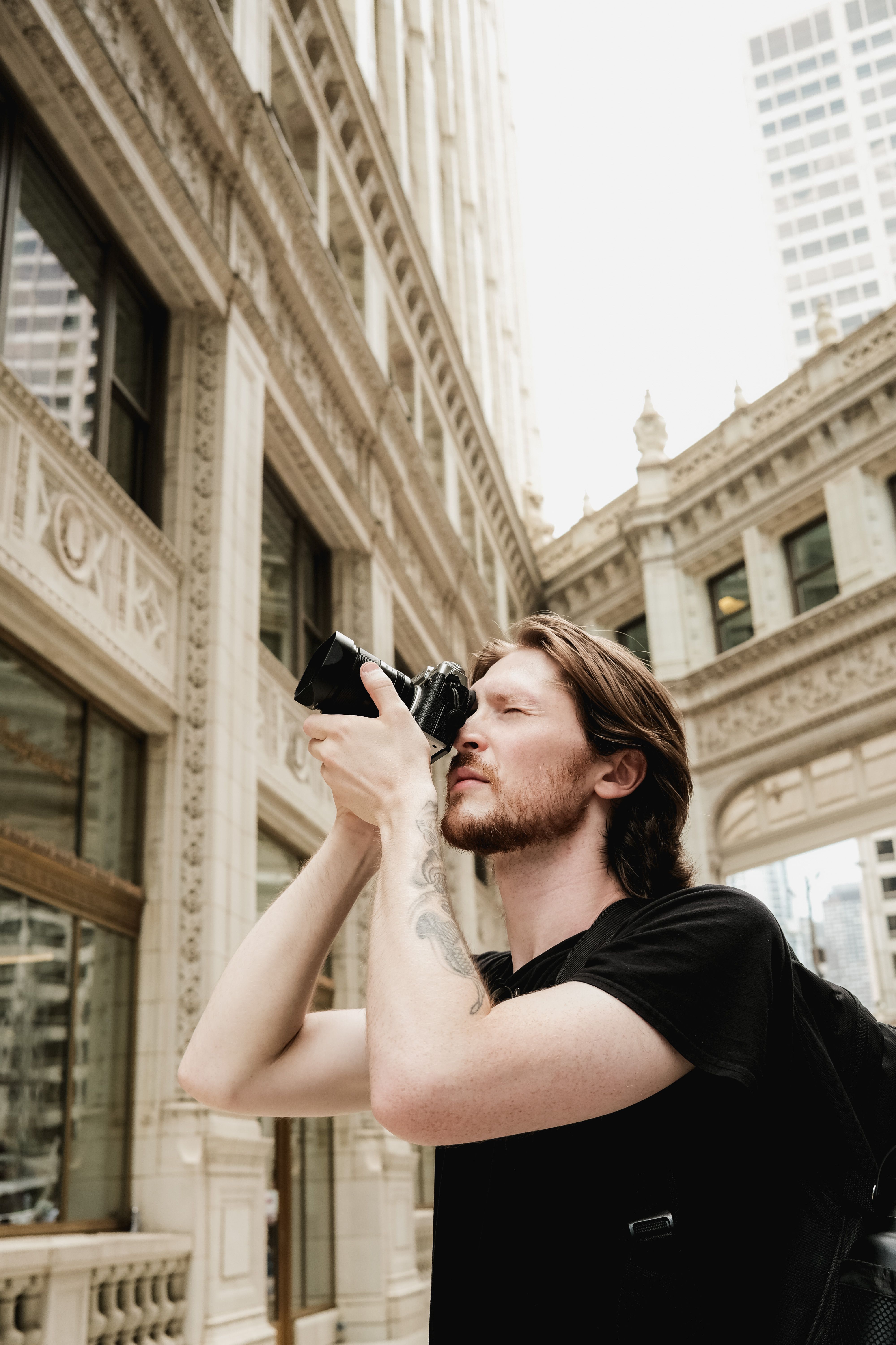 A man taking a photo of a building · Free Stock Photo