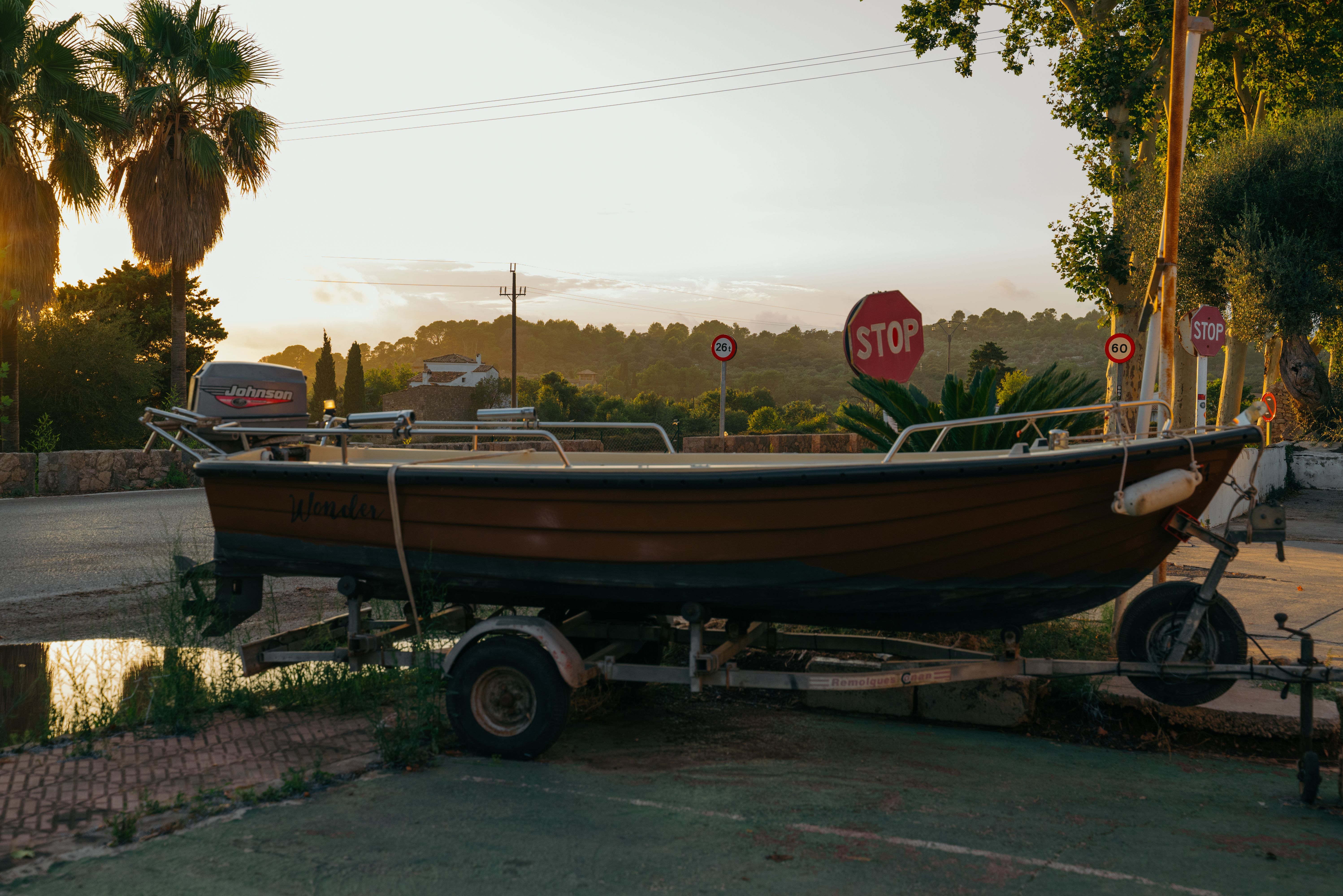 A boat parked on the side of the road · Free Stock Photo