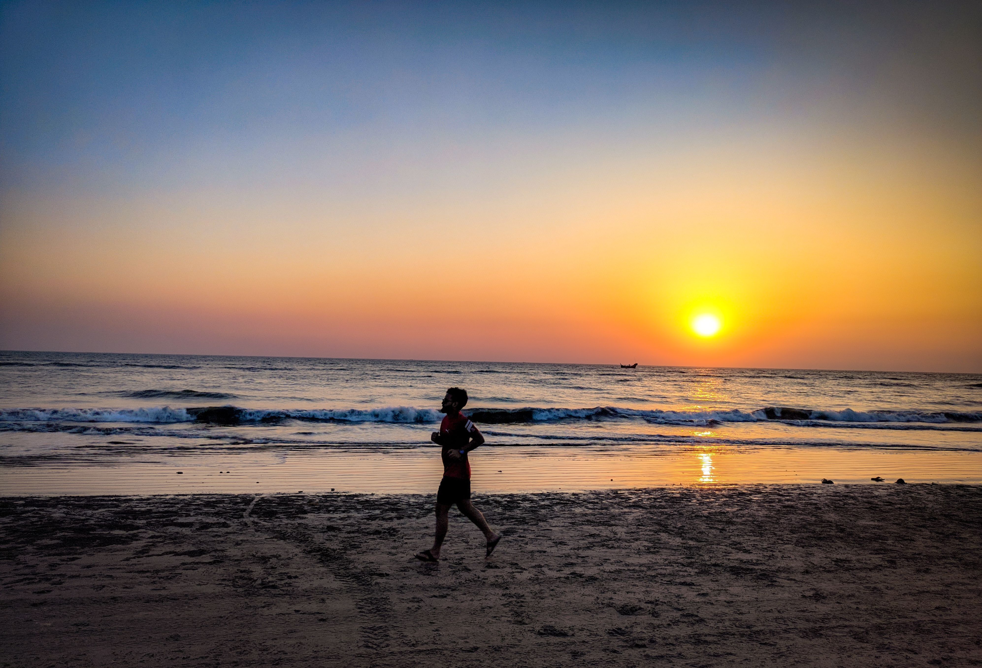 A person running on the beach at sunset · Free Stock Photo