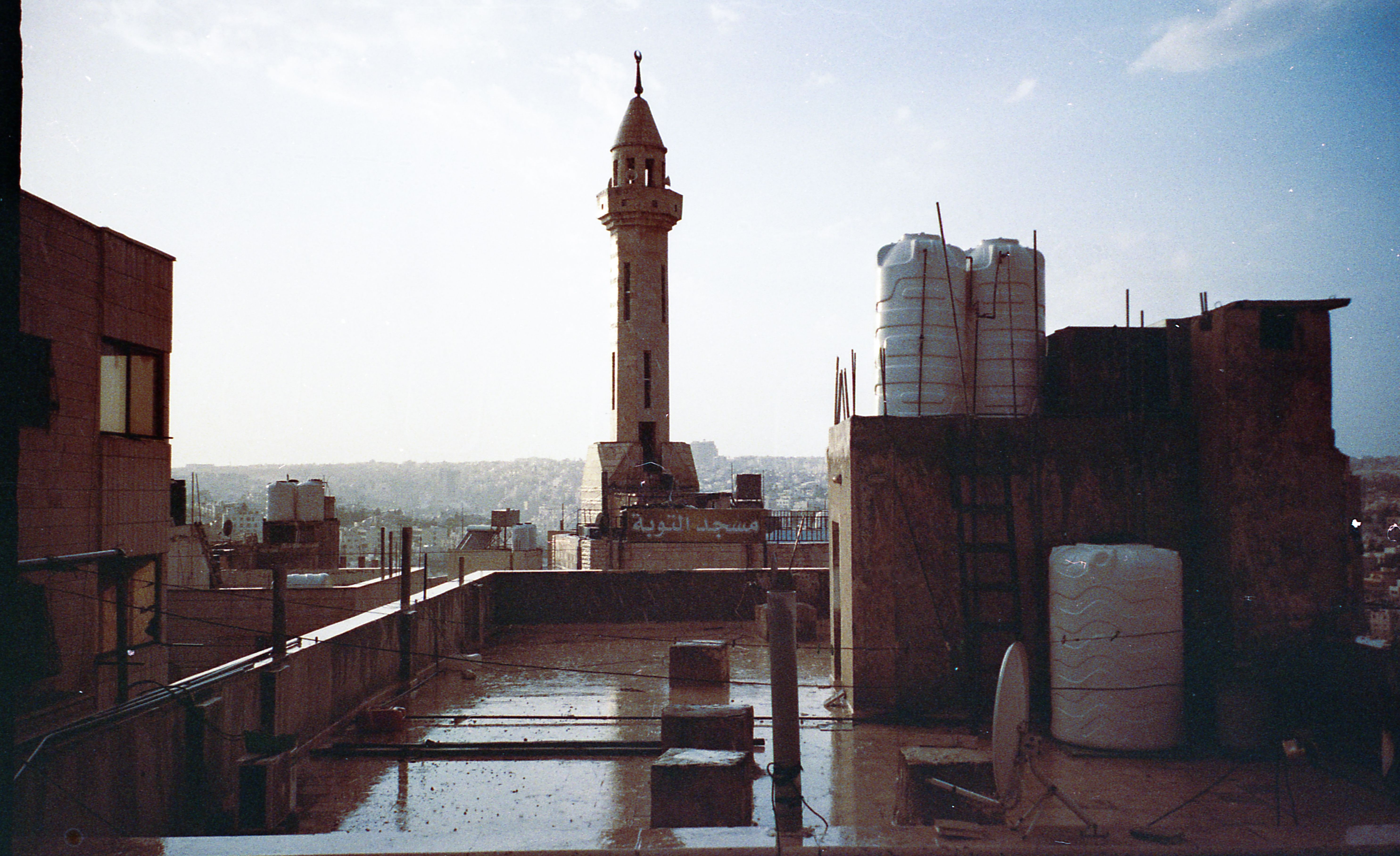 A view of a tower from a rooftop · Free Stock Photo