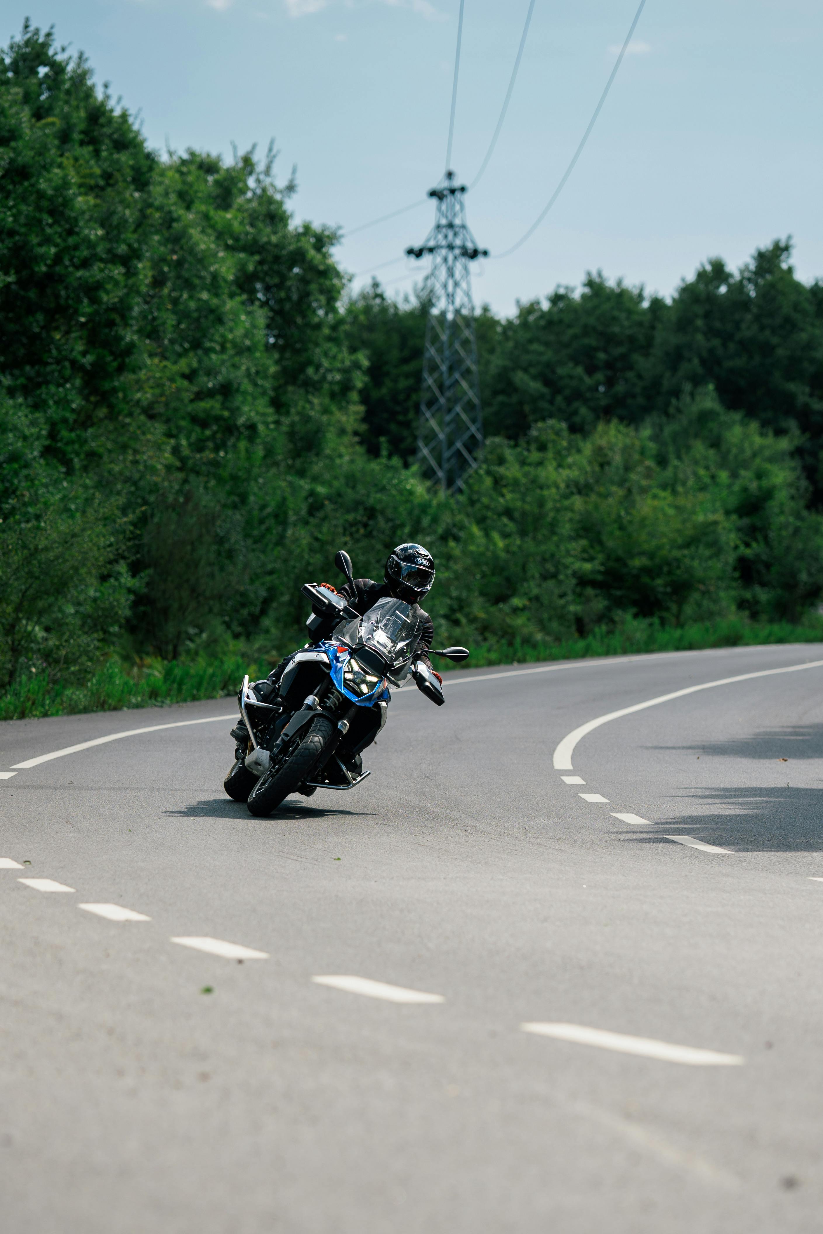 Black Backbone Motorcycle Near Man in Blue Shirt at Daytime · Free ...